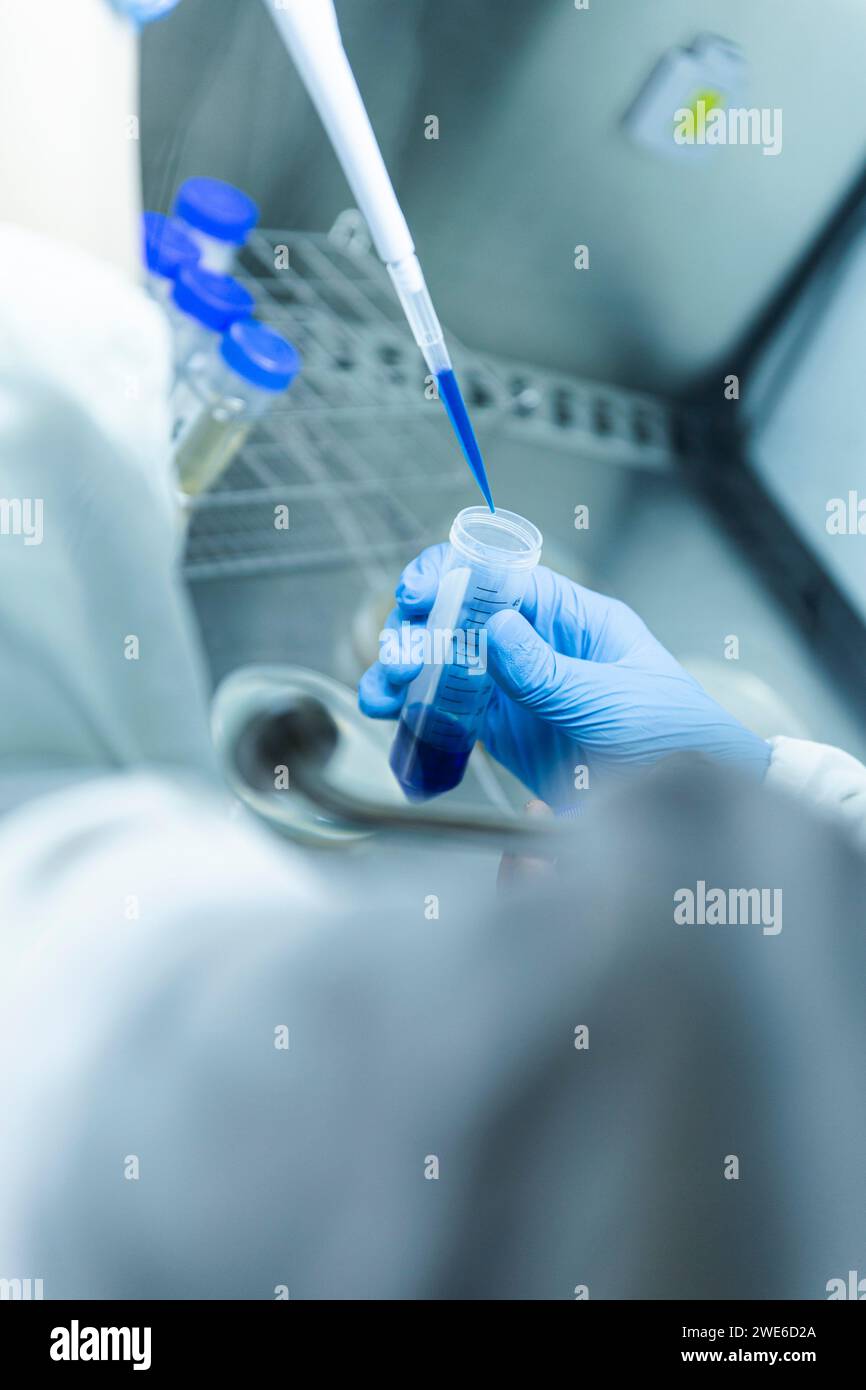 Scientist taking sample from tube hi-res stock photography and images ...