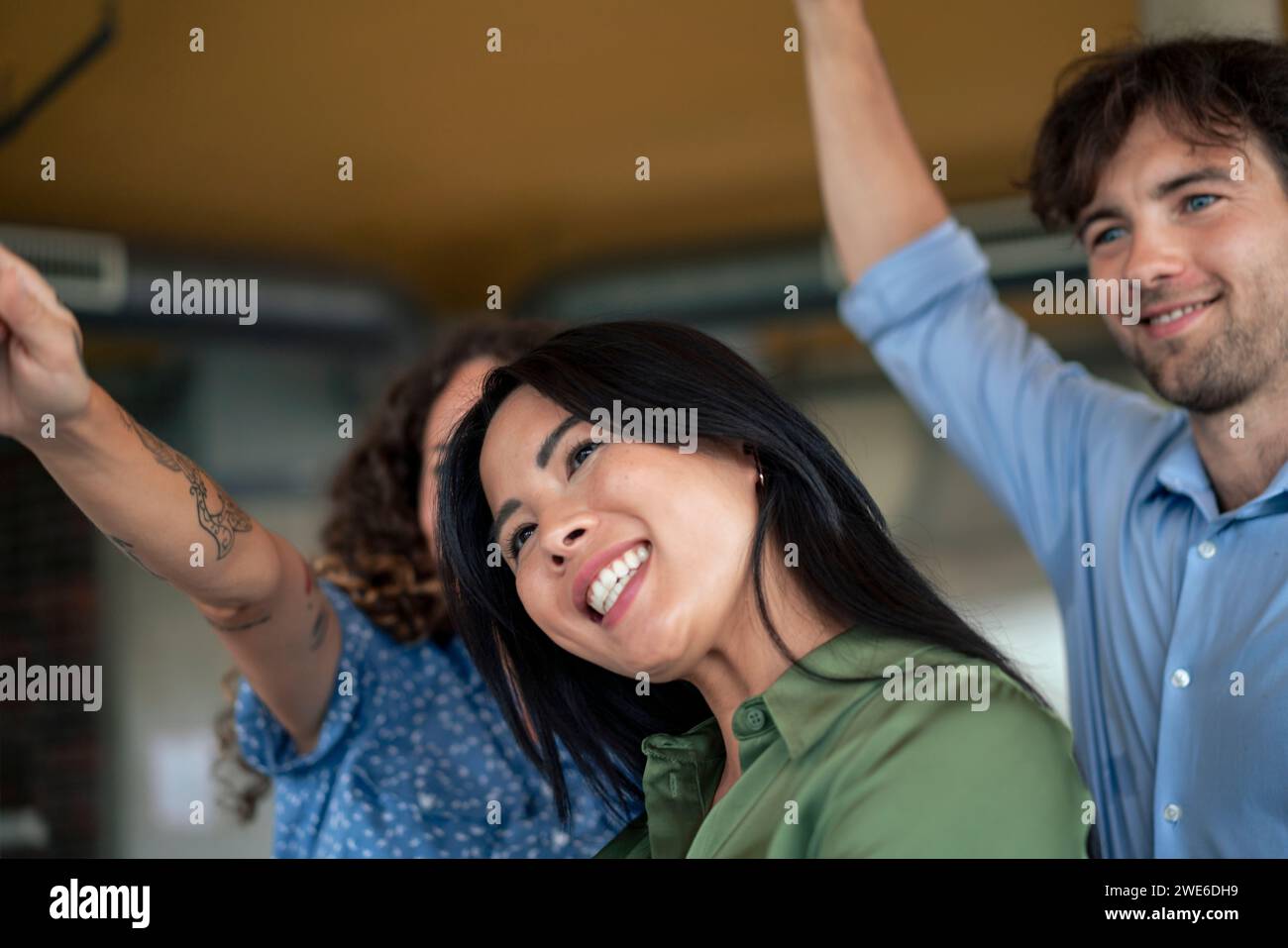 Happy colleagues dancing in office hi-res stock photography and images ...