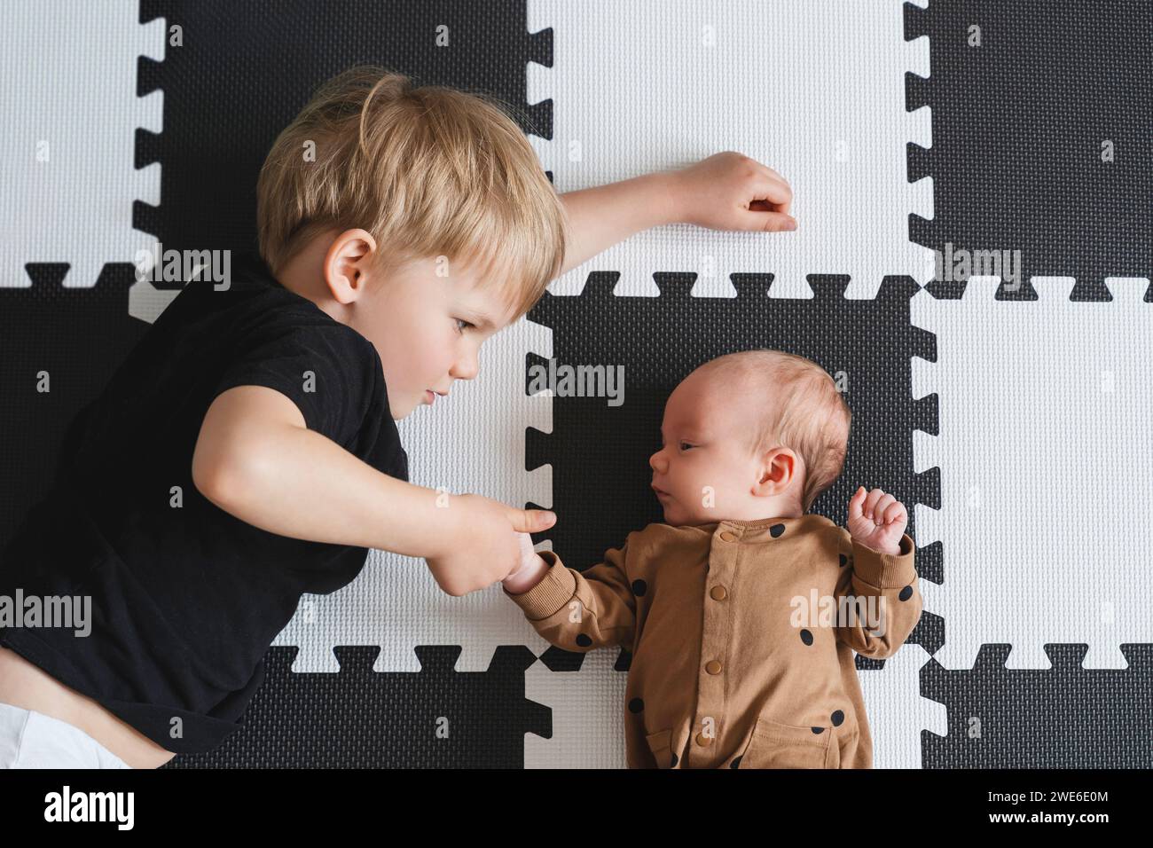 Brothers hand in hand hi-res stock photography and images - Alamy