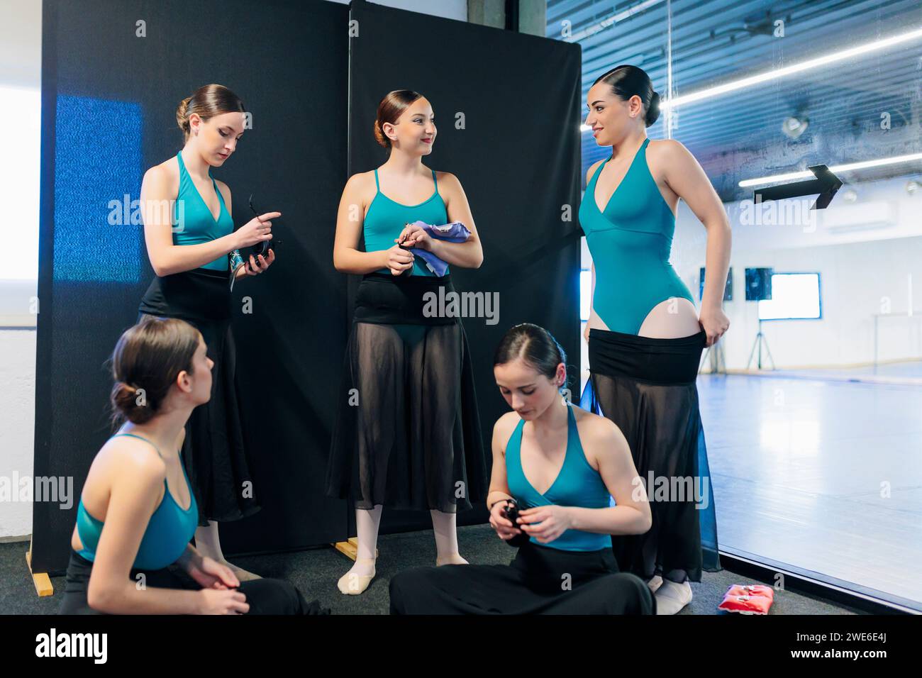 Dancers getting dressed for rehearsal at studio Stock Photo - Alamy