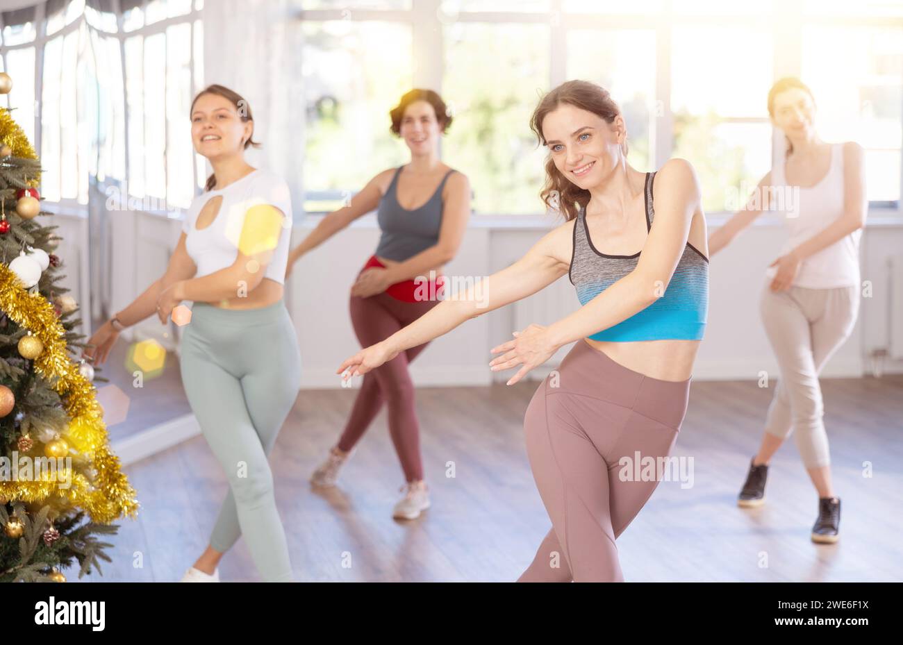 Slender young women dancers dance a swing steps in modern way during ...