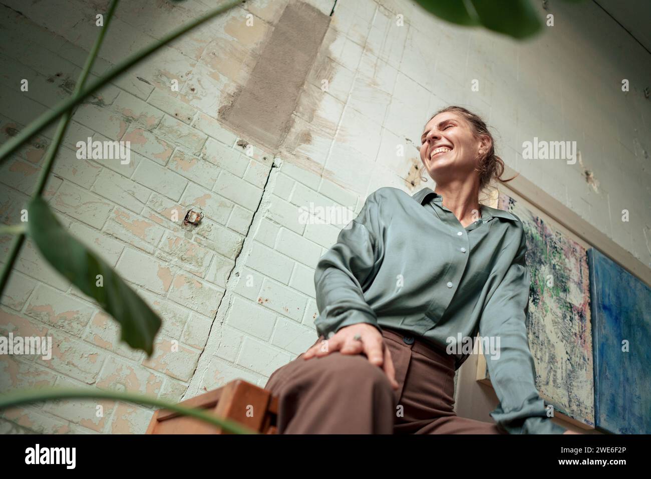 Professional painter painting wall in hi-res stock photography and ...