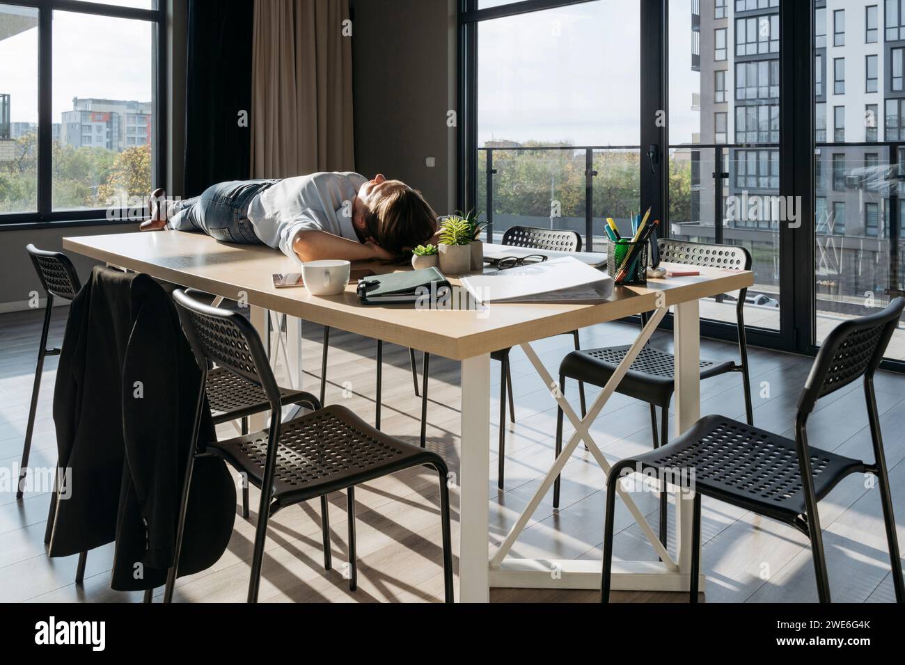 Businesswoman sleeping on chair hi-res stock photography and images - Alamy