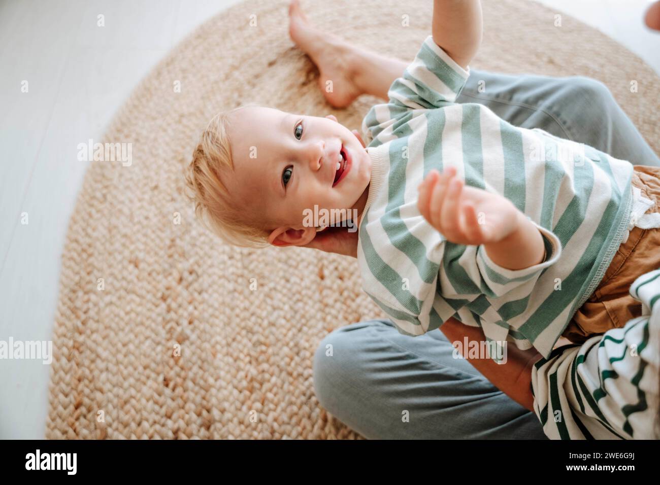 Happy baby being held hi-res stock photography and images - Alamy