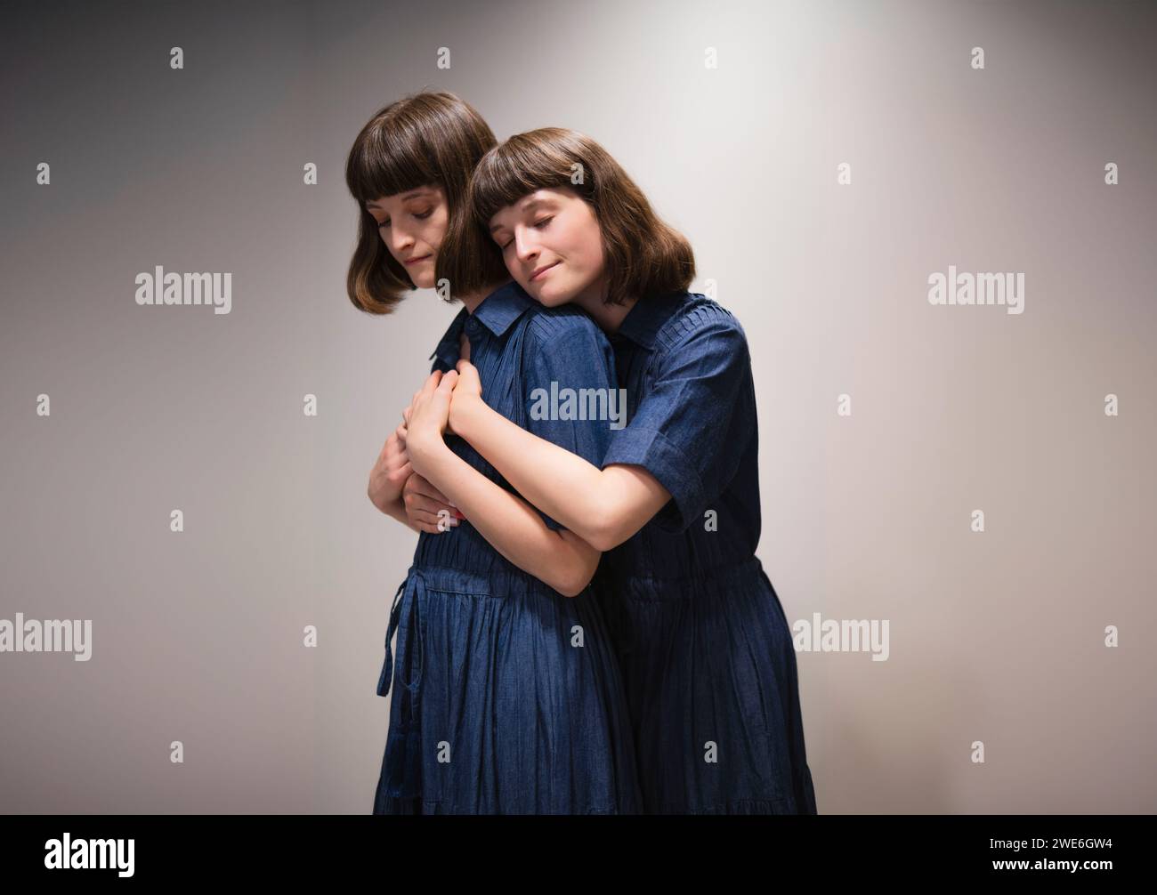 Twin sisters hugging hi-res stock photography and images - Alamy