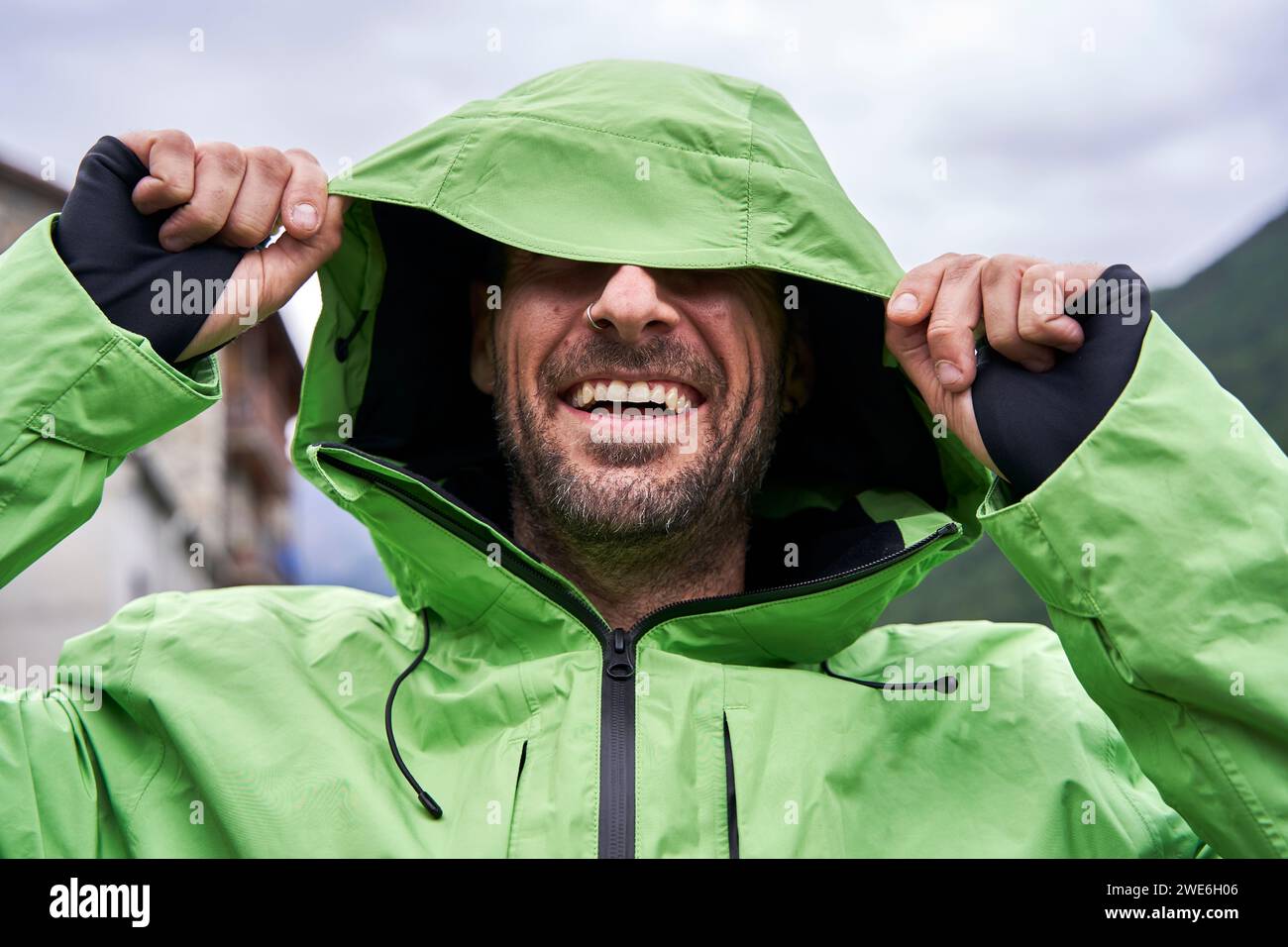 Person in green jacket hi-res stock photography and images - Alamy