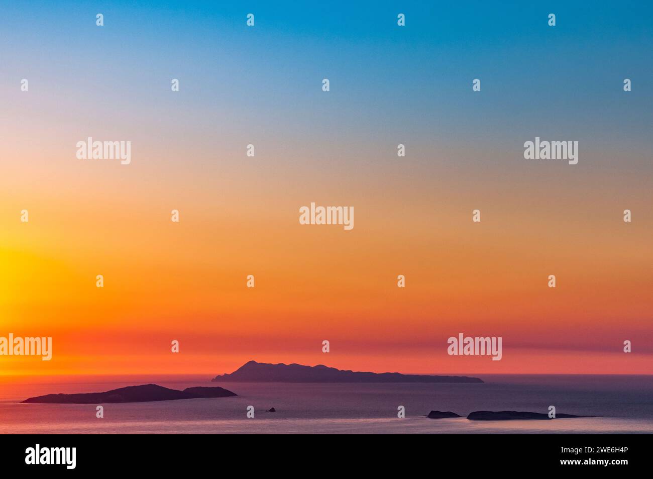 Greece, Ionian Islands, Moody sky over Nisida Kravi island at dusk ...