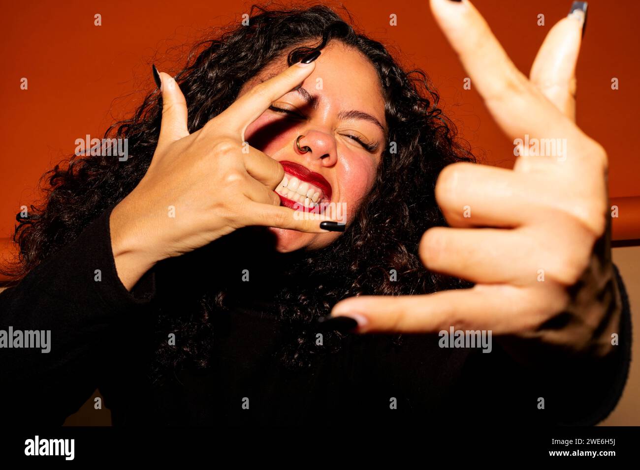 Hand woman showing shaka sign hi-res stock photography and images - Alamy