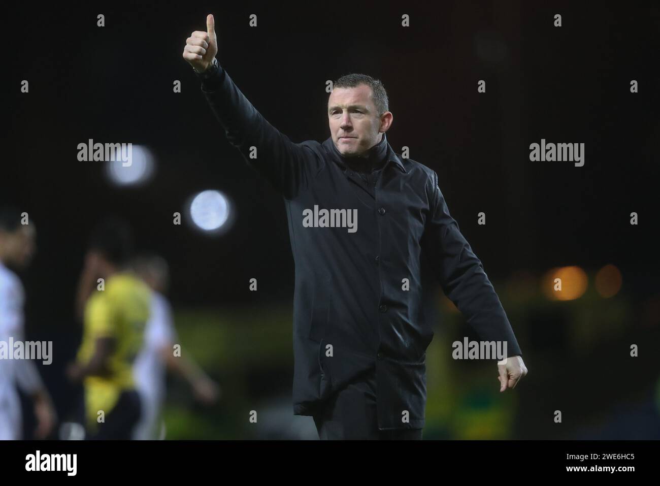Neill Collins Head coach of Barnsley gives the travelling fans a thumbs ...