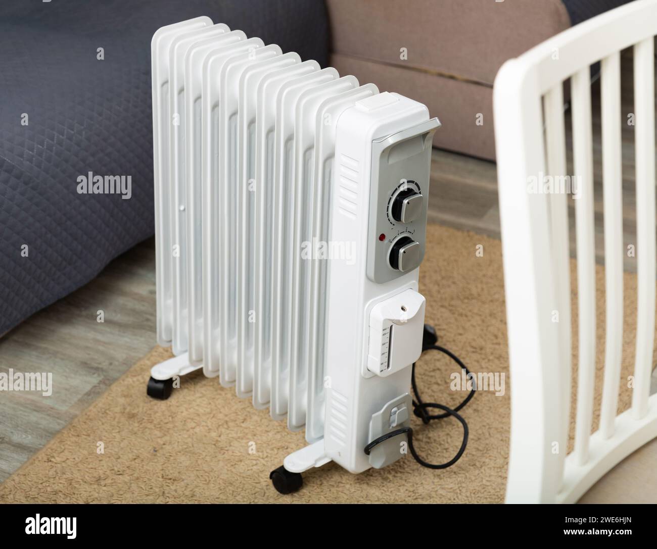 Oil filled radiator used in an room; standing in center of room Stock ...