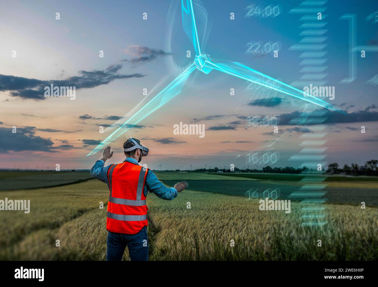 Engineer wearing reflective jacket and working in field Stock Photo - Alamy
