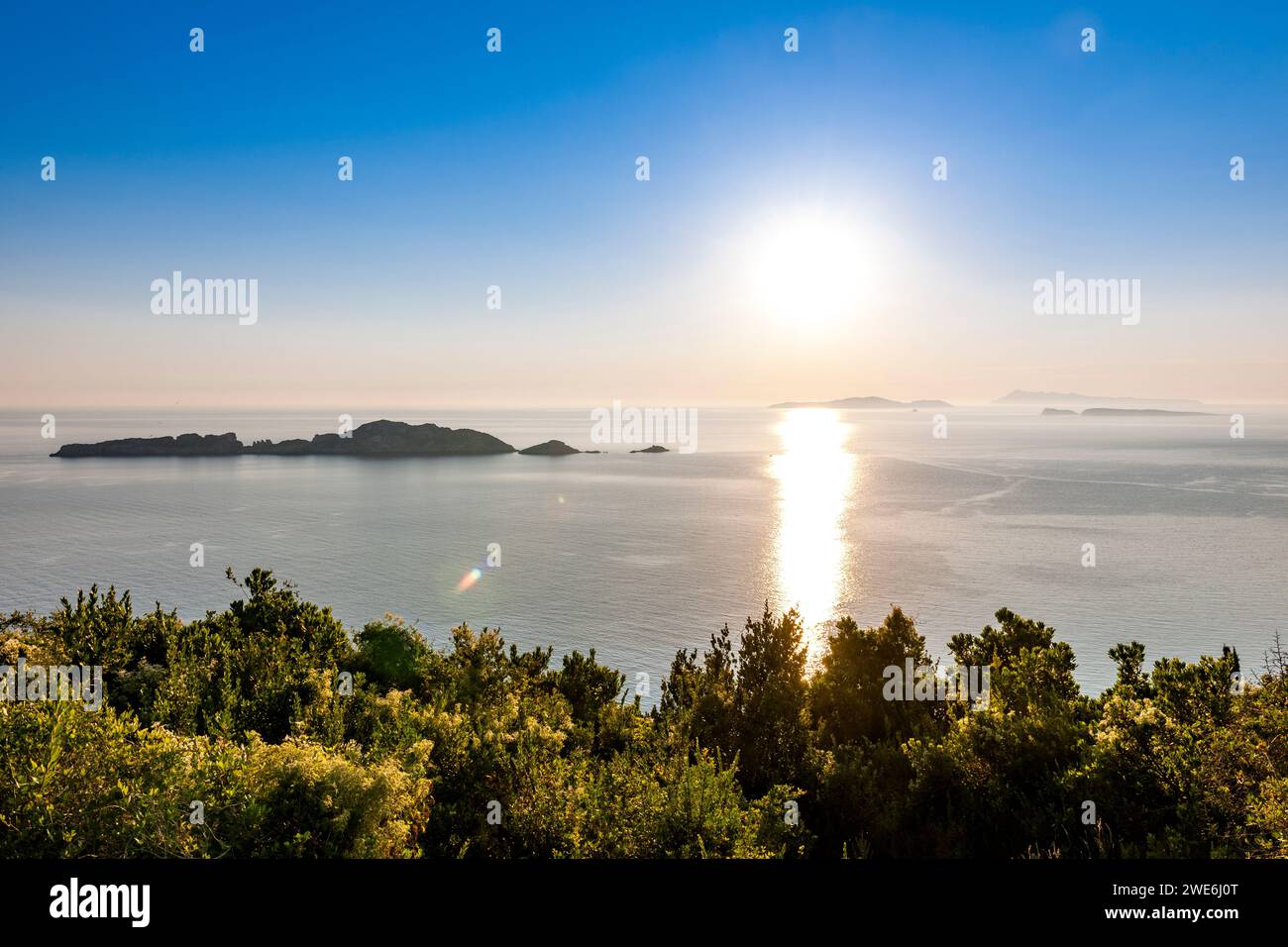 Greece, Ionian Islands, Sun setting over Nisida Kravi island Stock ...
