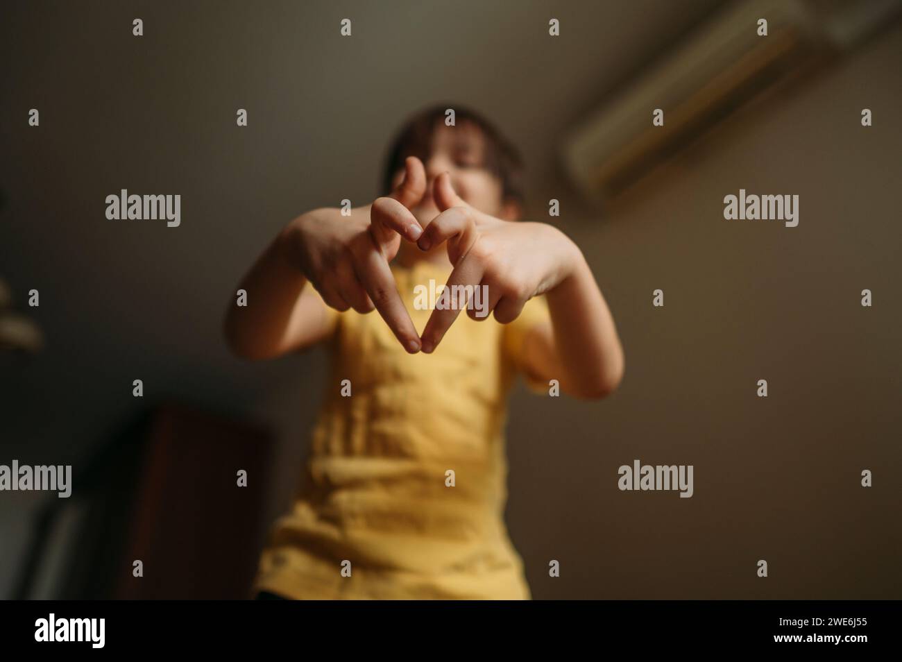 Child hand making heart hi-res stock photography and images - Alamy