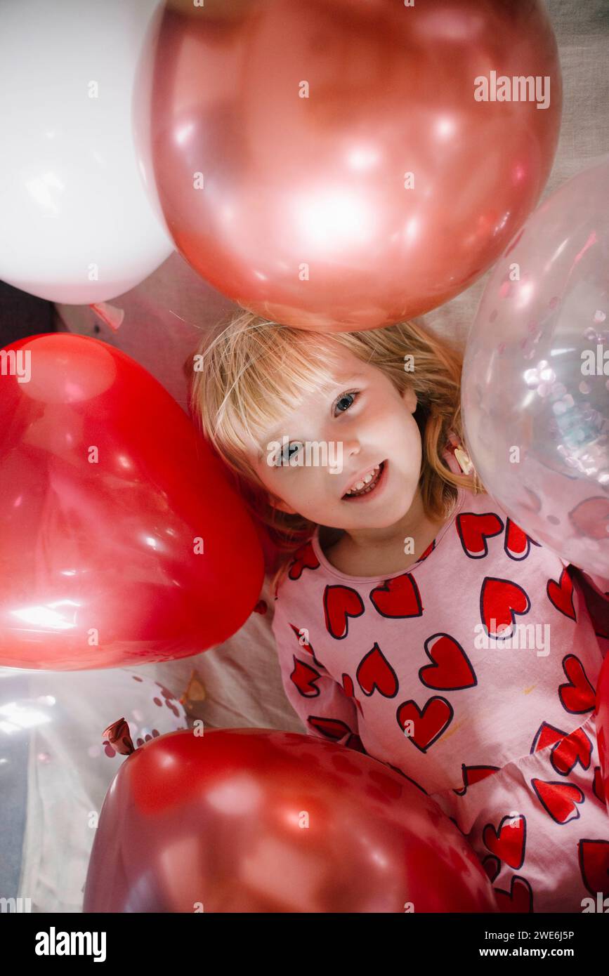 Girl in red dress balloons hi-res stock photography and images - Alamy