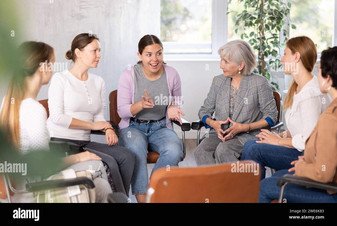 in group lesson, students are animatedly discussing ways to perform ...