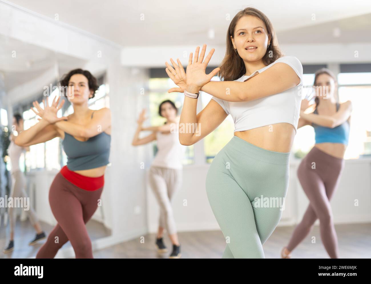 Group of women dancing modern dance in studio Stock Photo - Alamy