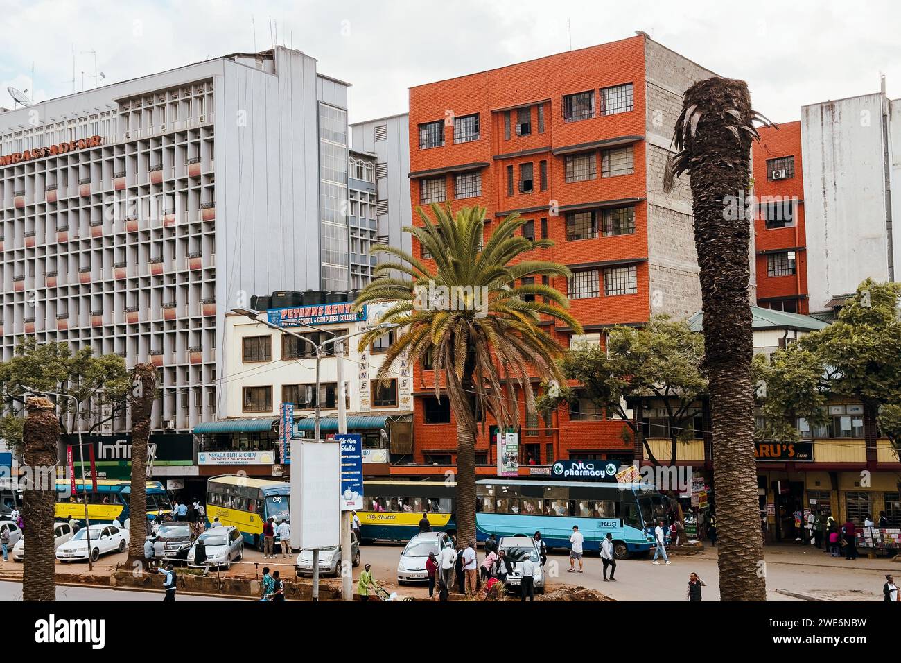 View of Moi Avenue Street with public transport vehicles and people on ...