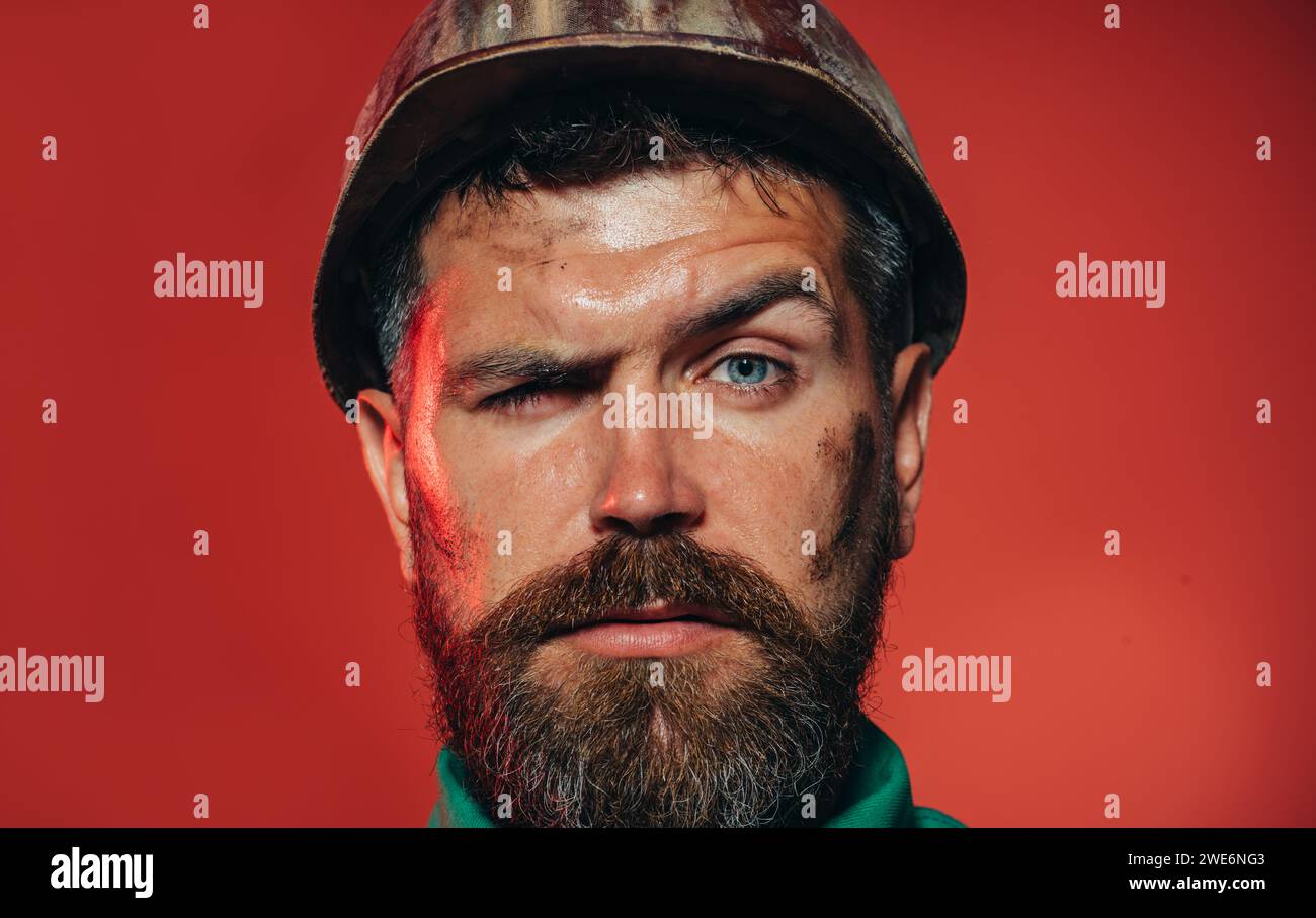 Closeup portrait of mechanical or industrial worker in protective hard ...
