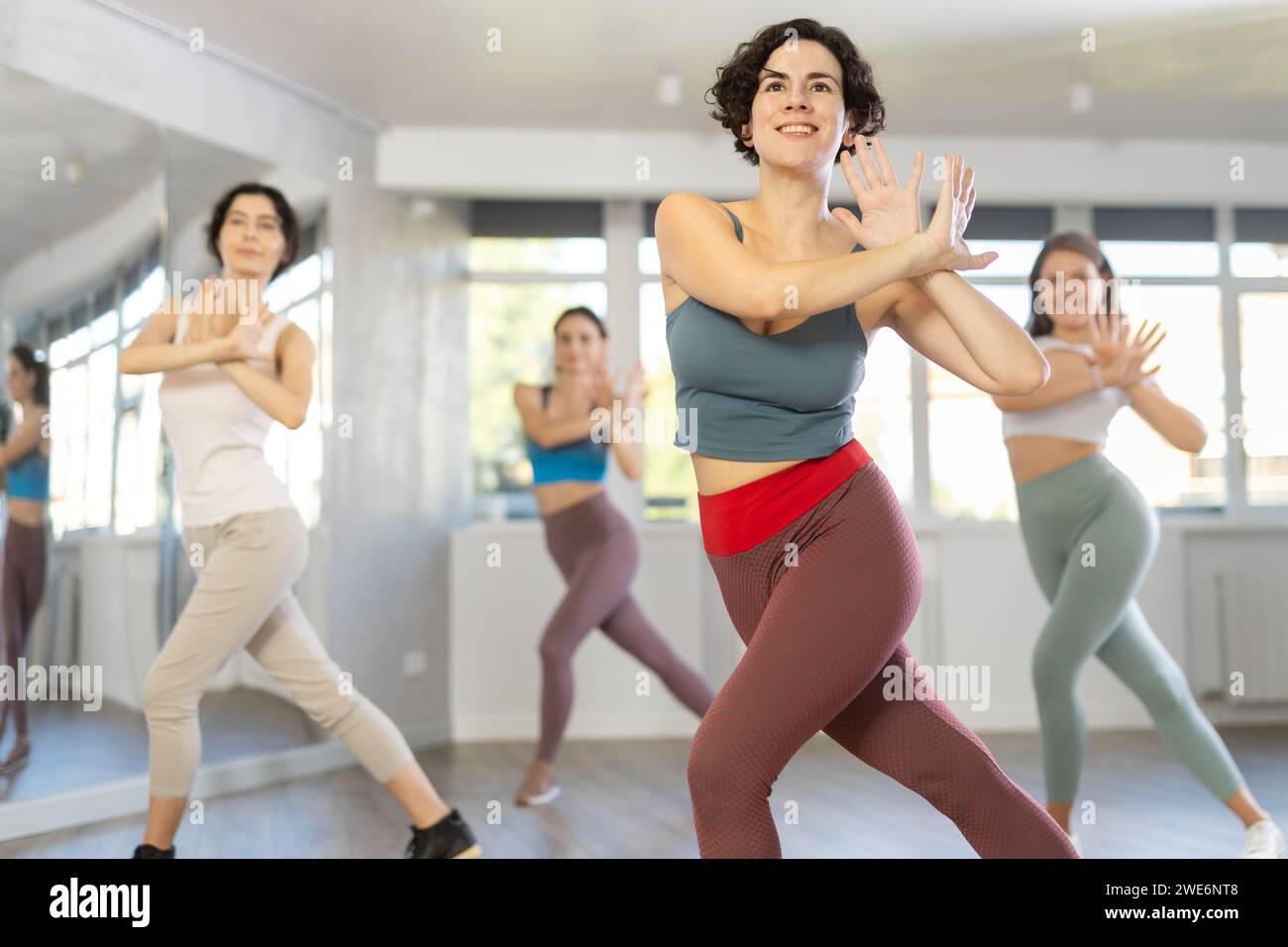 Group of women dancing modern dance in studio Stock Photo - Alamy
