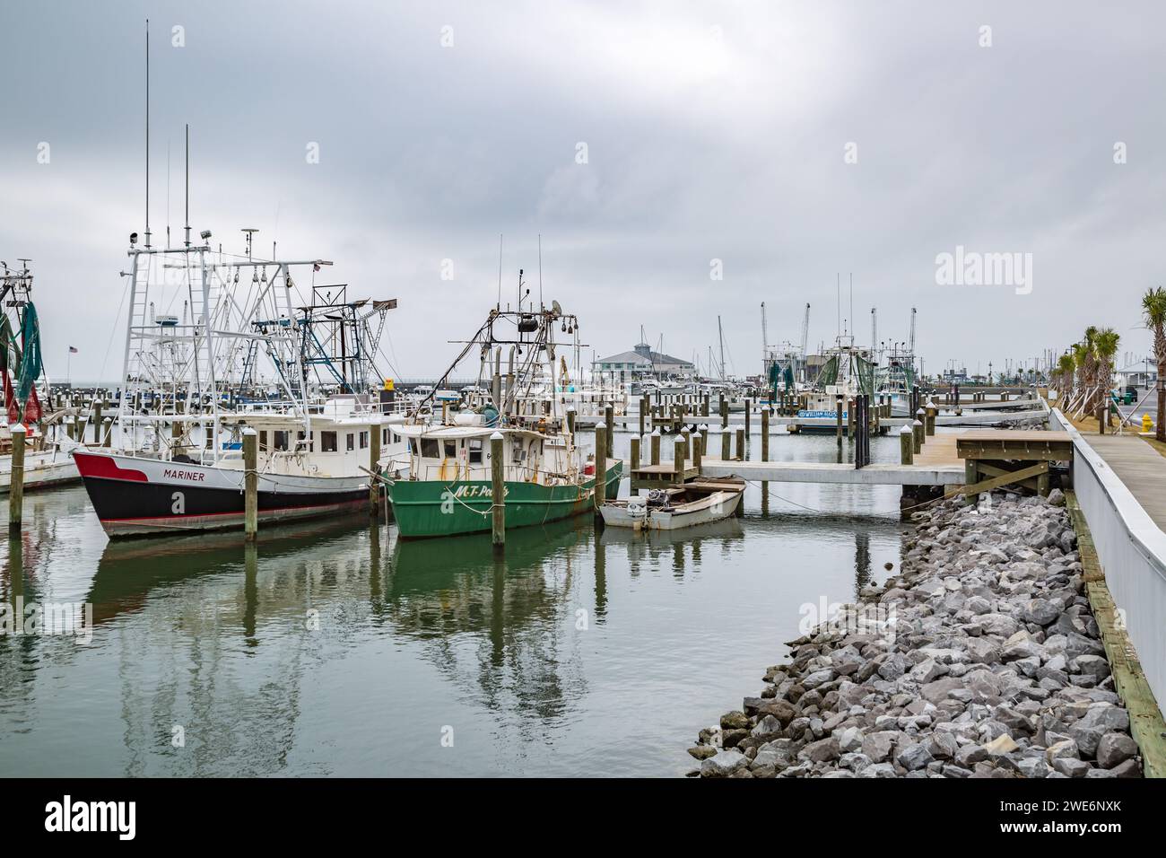 Commerial shrimp and fishing boats docked in the harbor at Pass ...