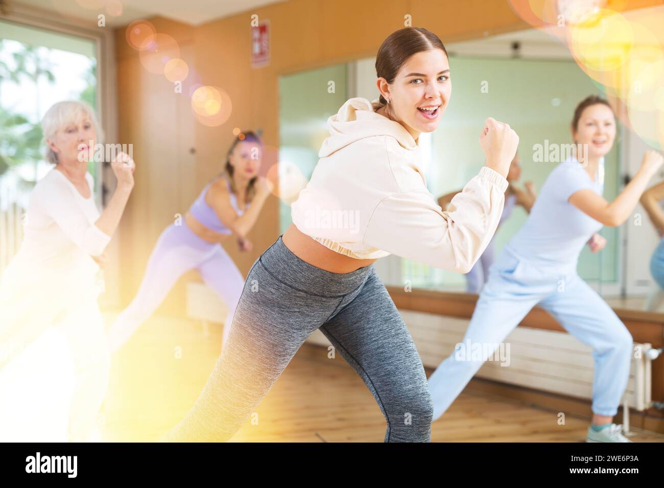 Group are practising arch movement in step jazz dance in fitness gym ...