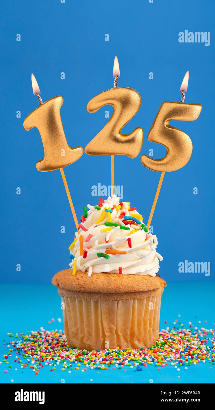 Candle number 125 - Cake birthday in blue background Stock Photo - Alamy