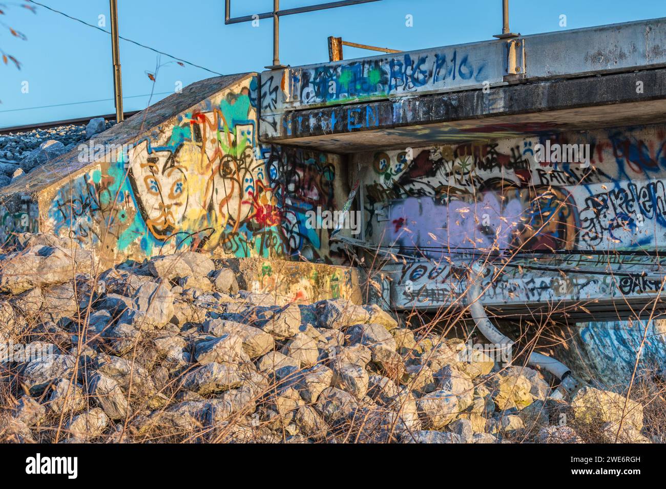Graffiti covered concrete railroad bridge abutment in Ocean Springs ...