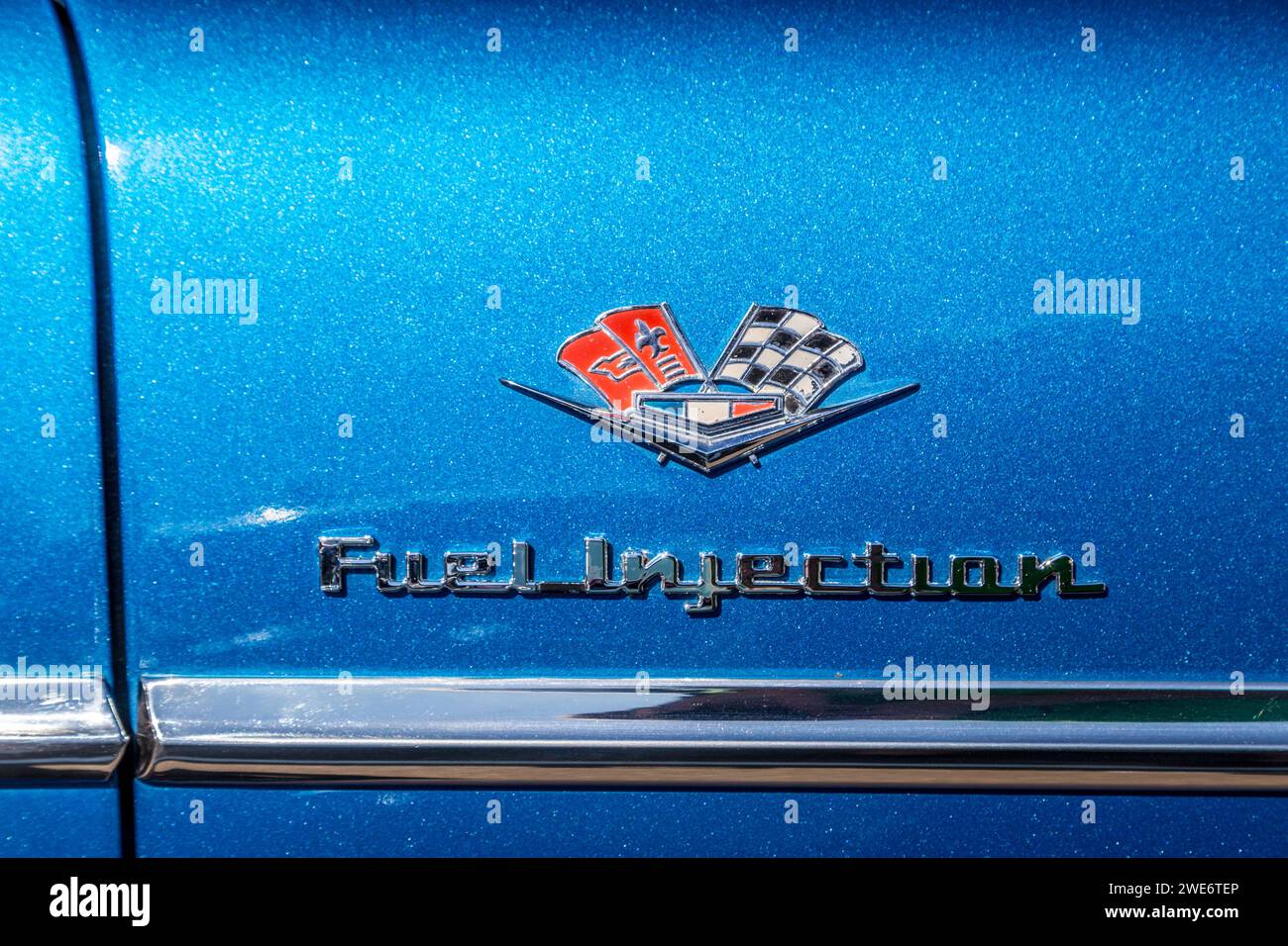Fuel Injection emblem on fender of classic car Stock Photo - Alamy