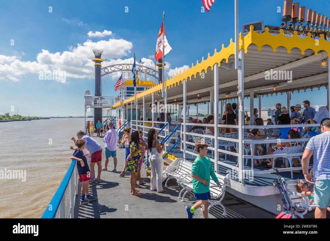 Passengers of the historic Creole Queen paddlewheel riverboat enjoying ...