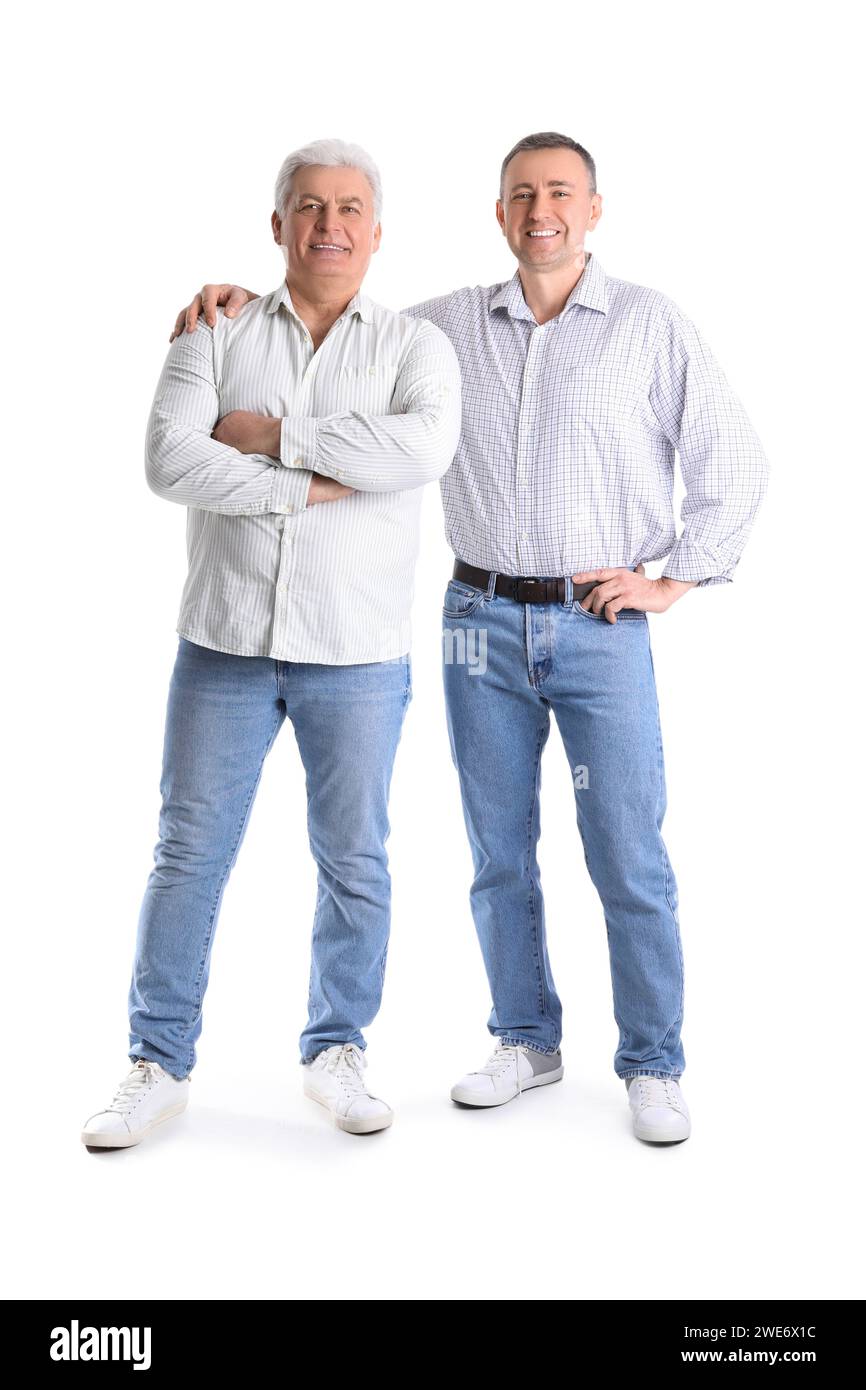 Mature brothers on white background Stock Photo - Alamy