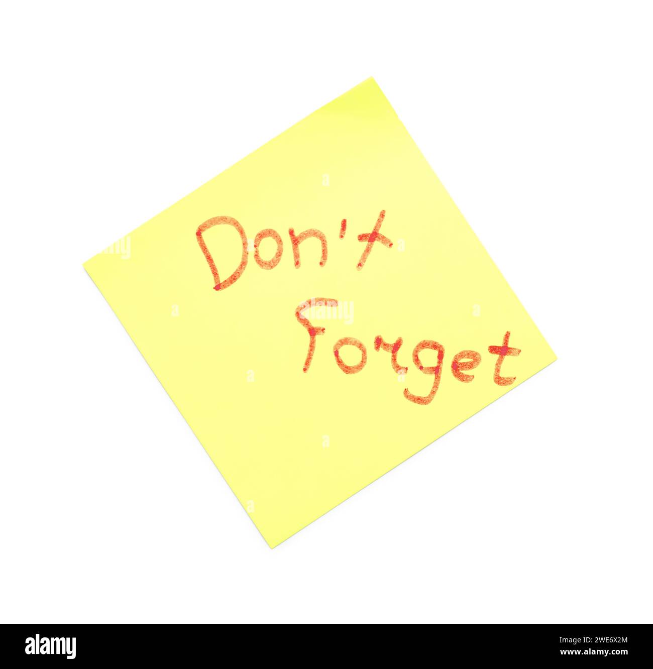 Sticky note with text DON'T FORGET on white background Stock Photo - Alamy
