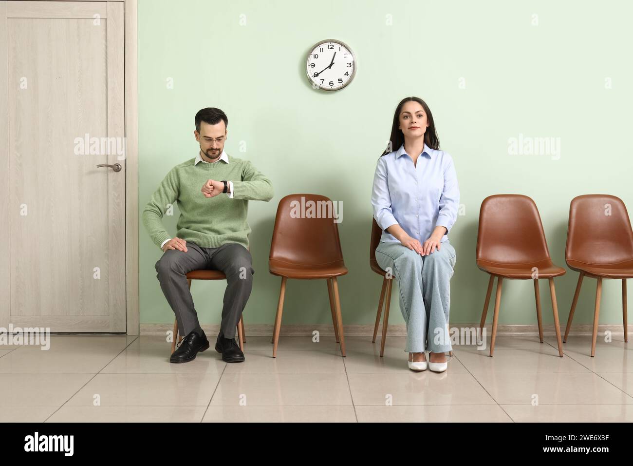 Young people waiting for job interview in room Stock Photo - Alamy
