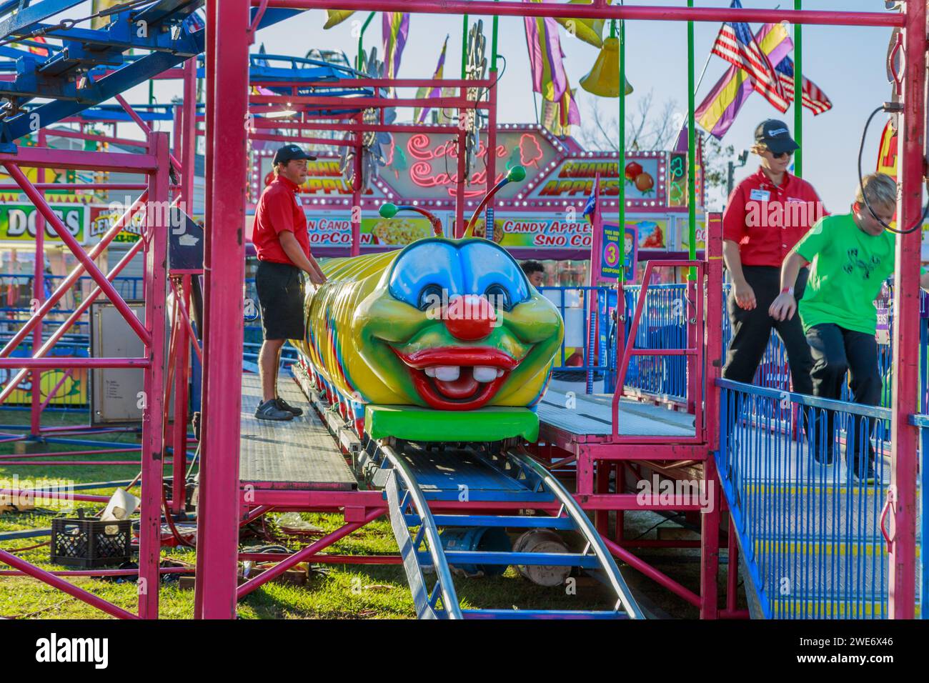 Colorful children's roller coaster ride at the Gulf State Fair in ...