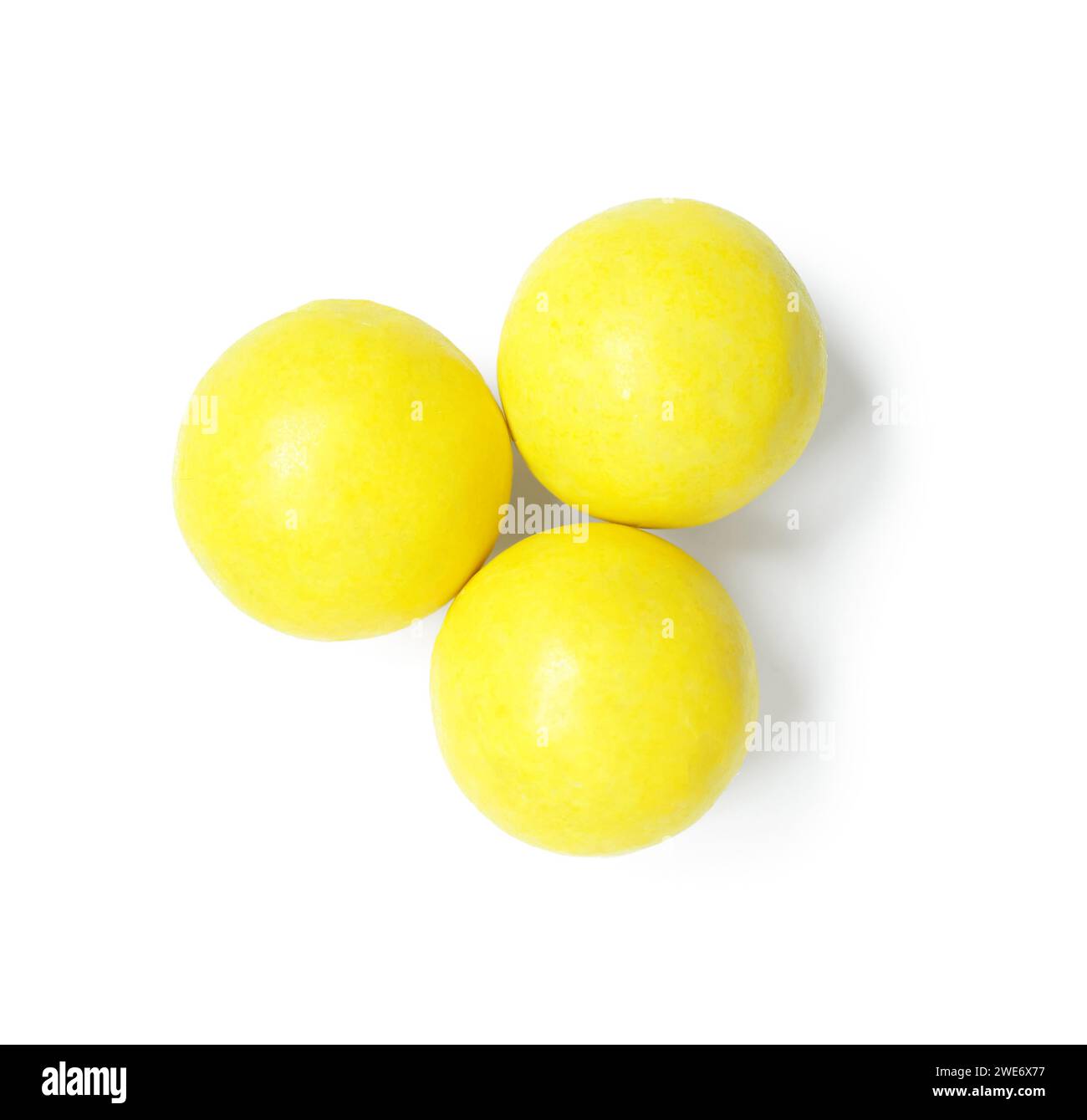 Yellow chewing gum on white background Stock Photo - Alamy