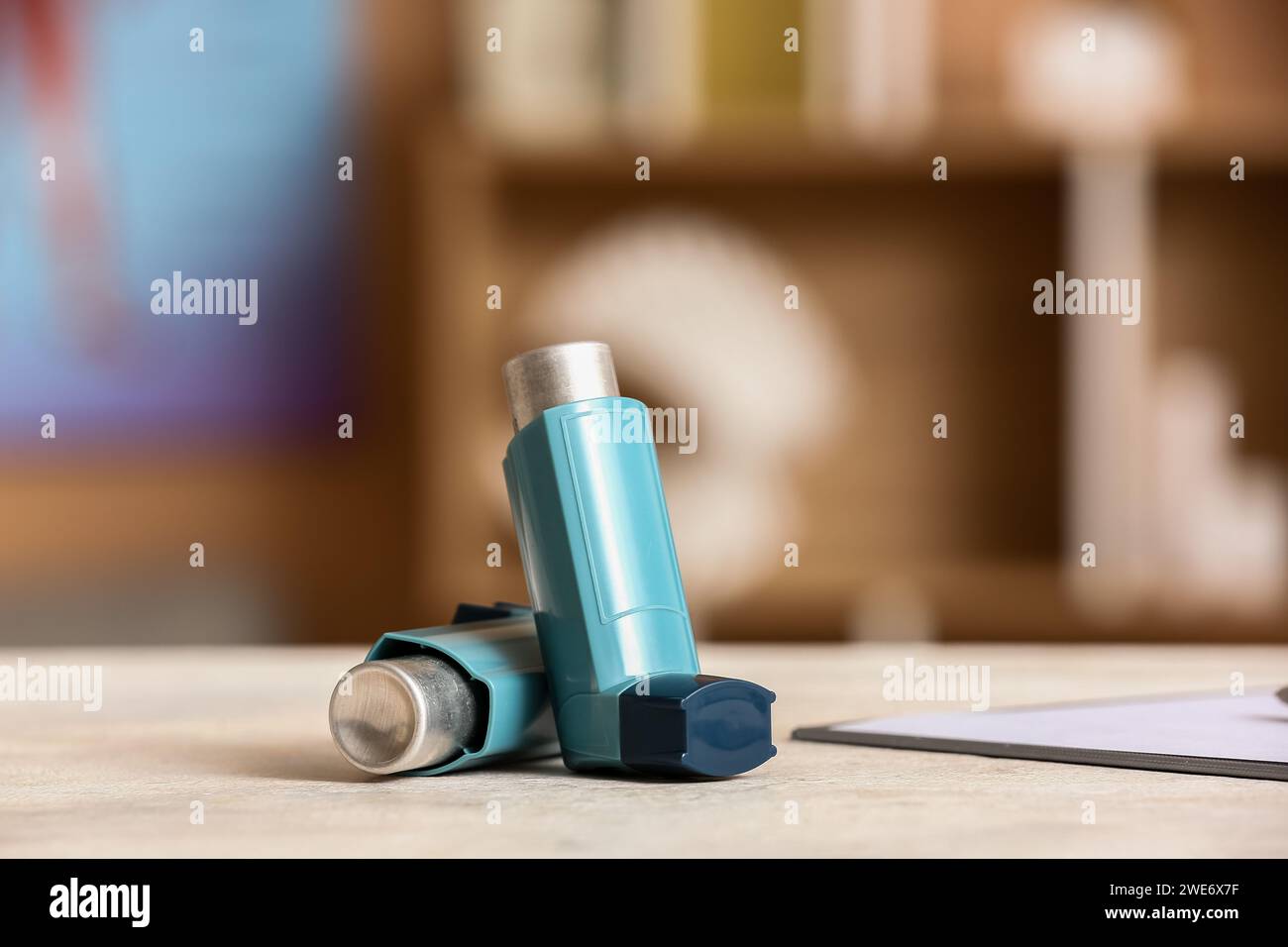 Asthma inhaler on table in doctor office Stock Photo - Alamy