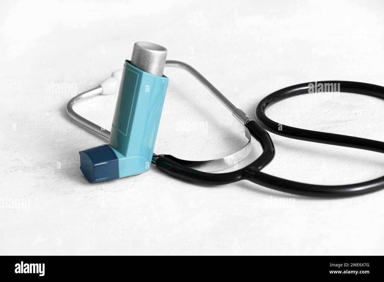 Asthma inhaler with stethoscope on table in doctor office Stock Photo ...