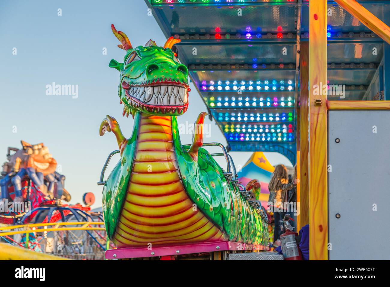 Colorful children's dragon roller coaster ride at the Gulf State Fair ...