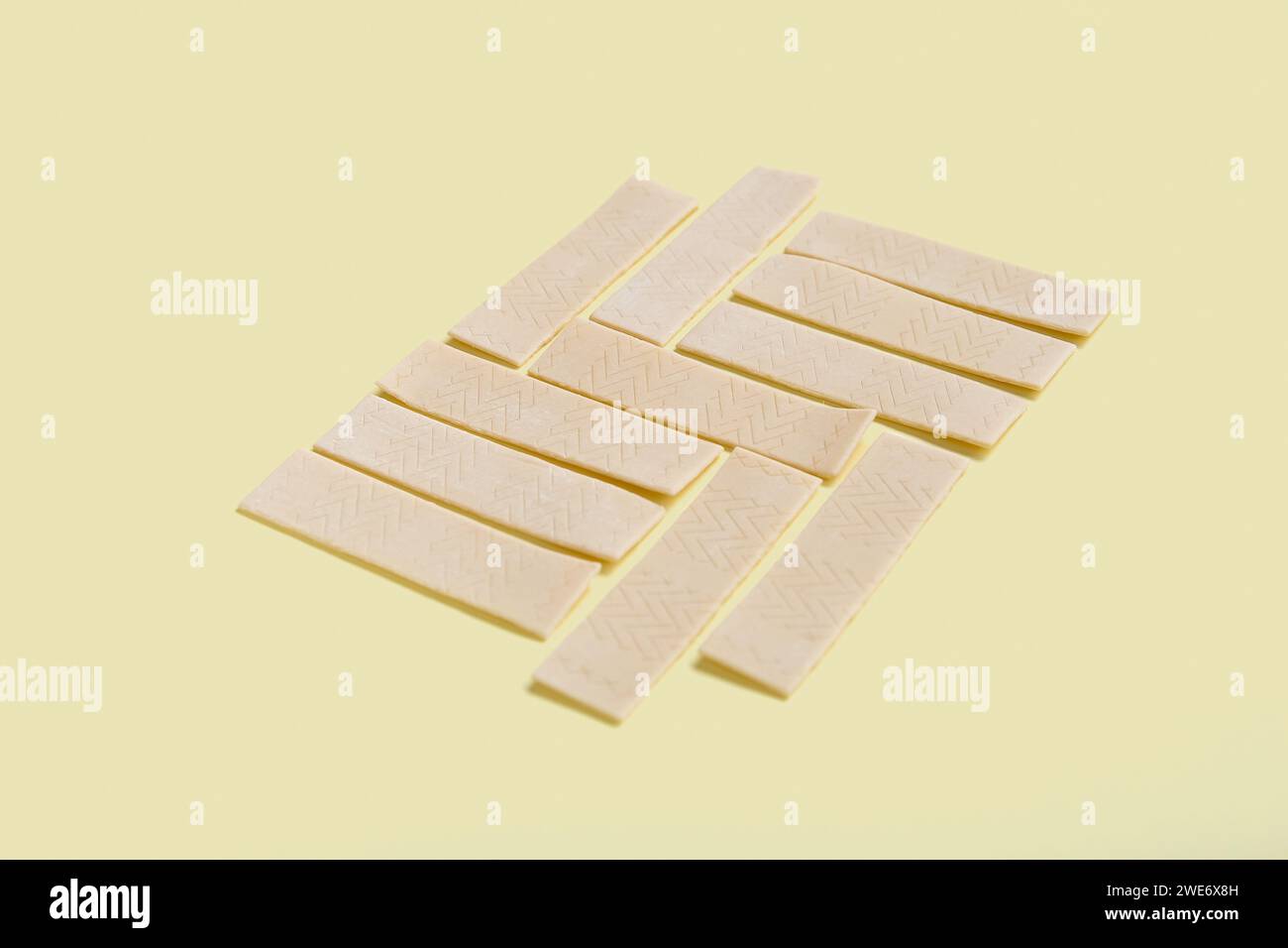 Chewing gums on light yellow background Stock Photo - Alamy