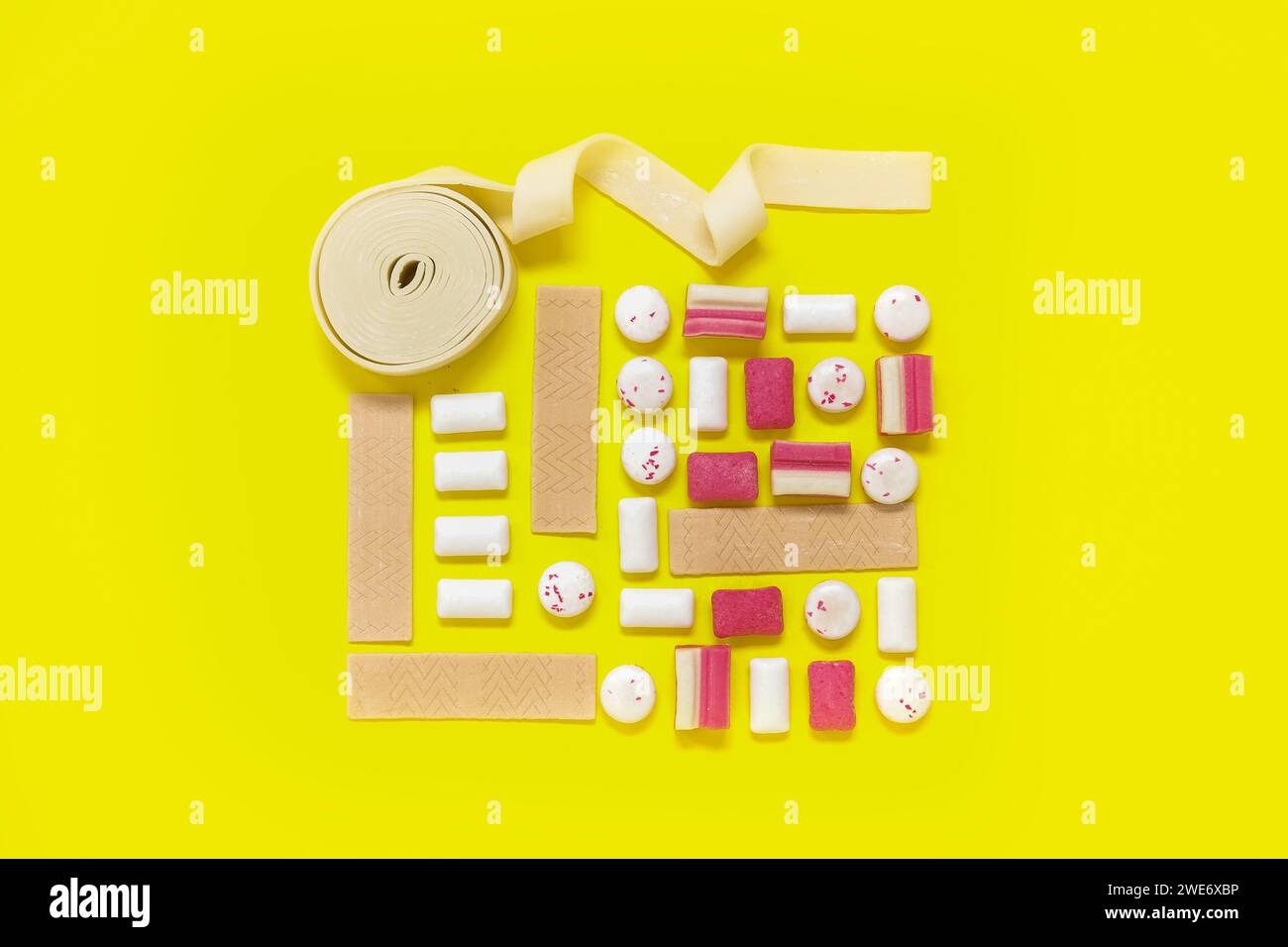 Many different chewing gums on yellow background Stock Photo - Alamy