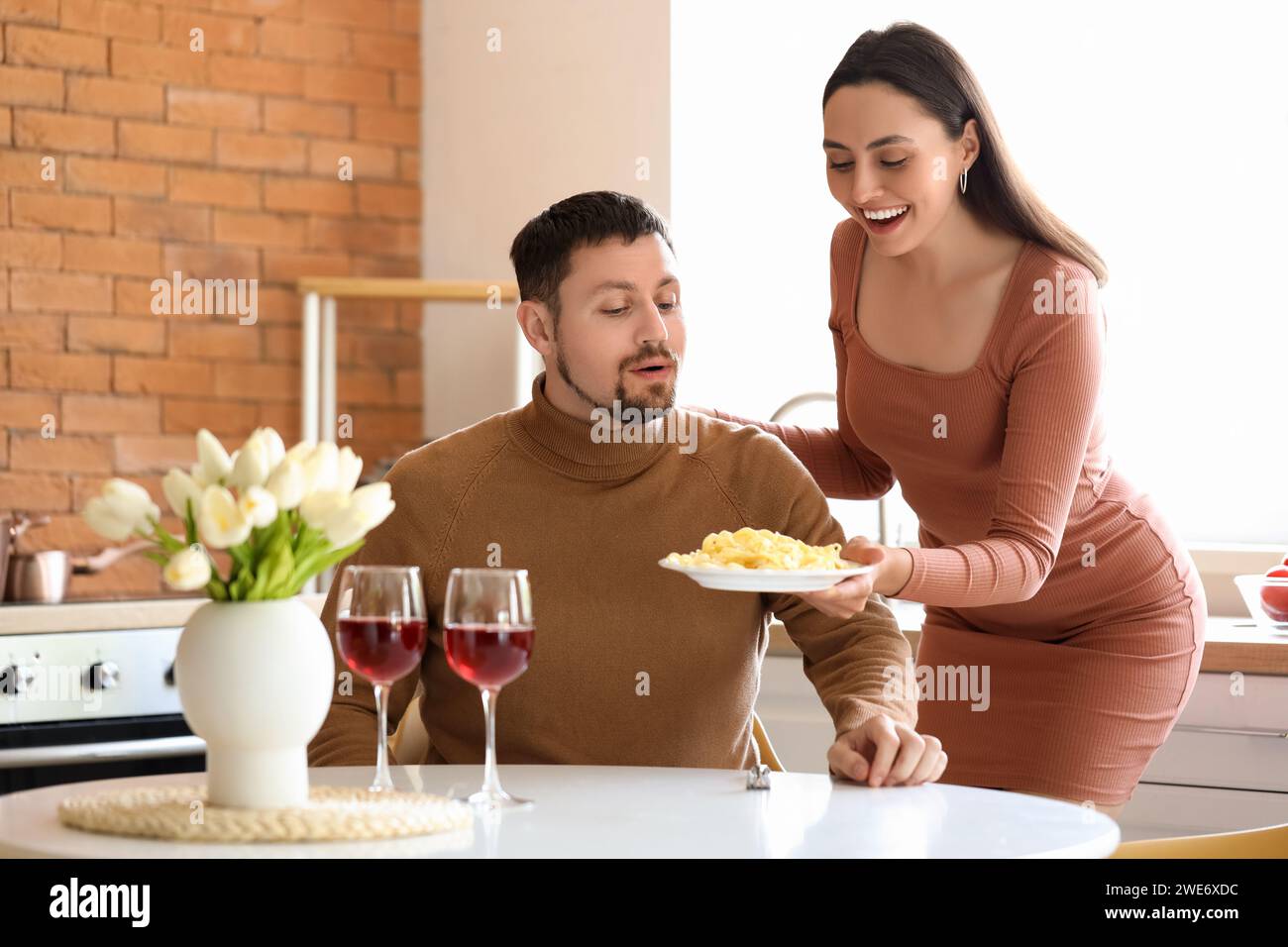 Happy family having spaghetti dinner hi-res stock photography and ...