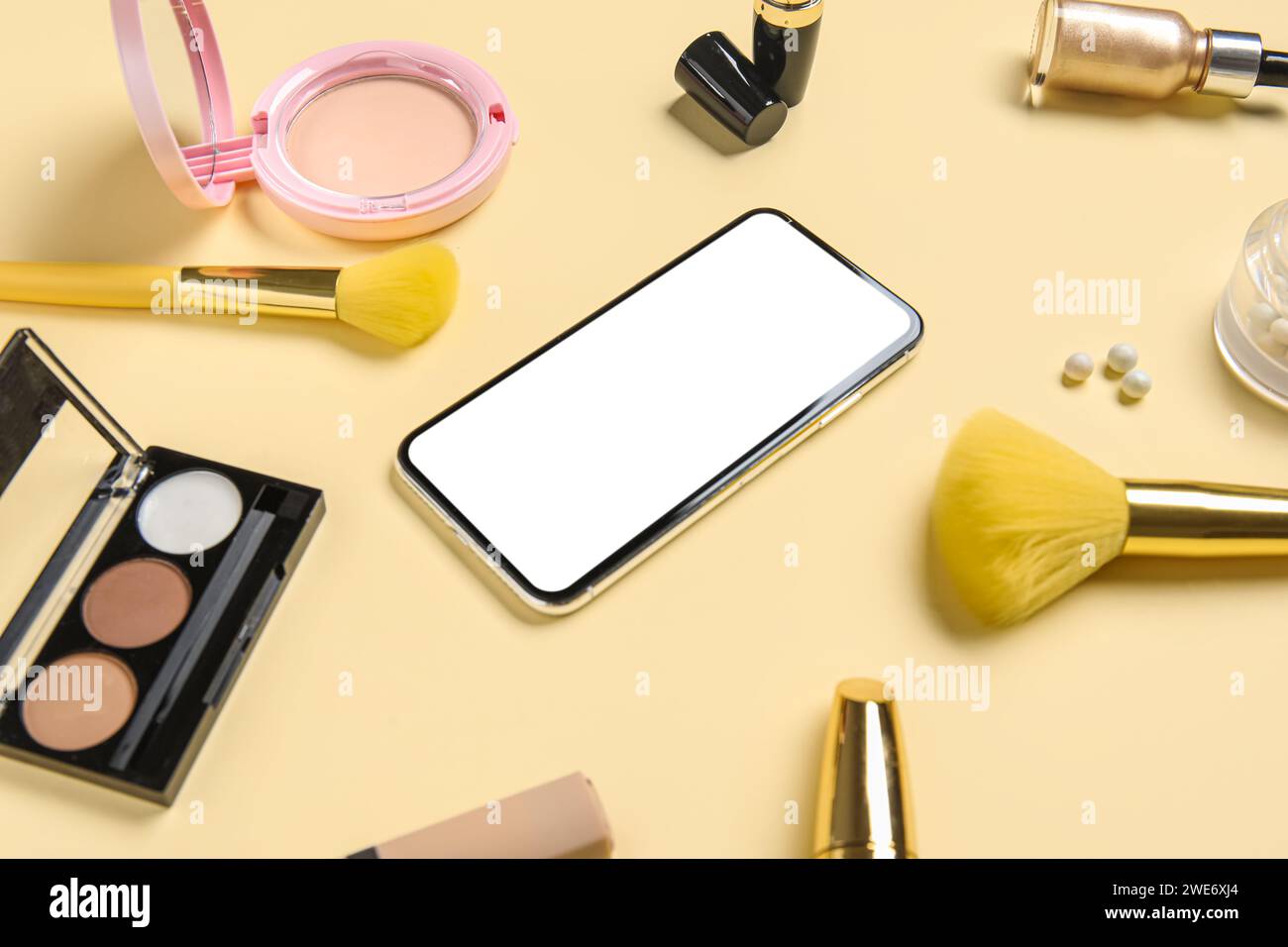 Composition with modern mobile phone, decorative cosmetics and makeup ...