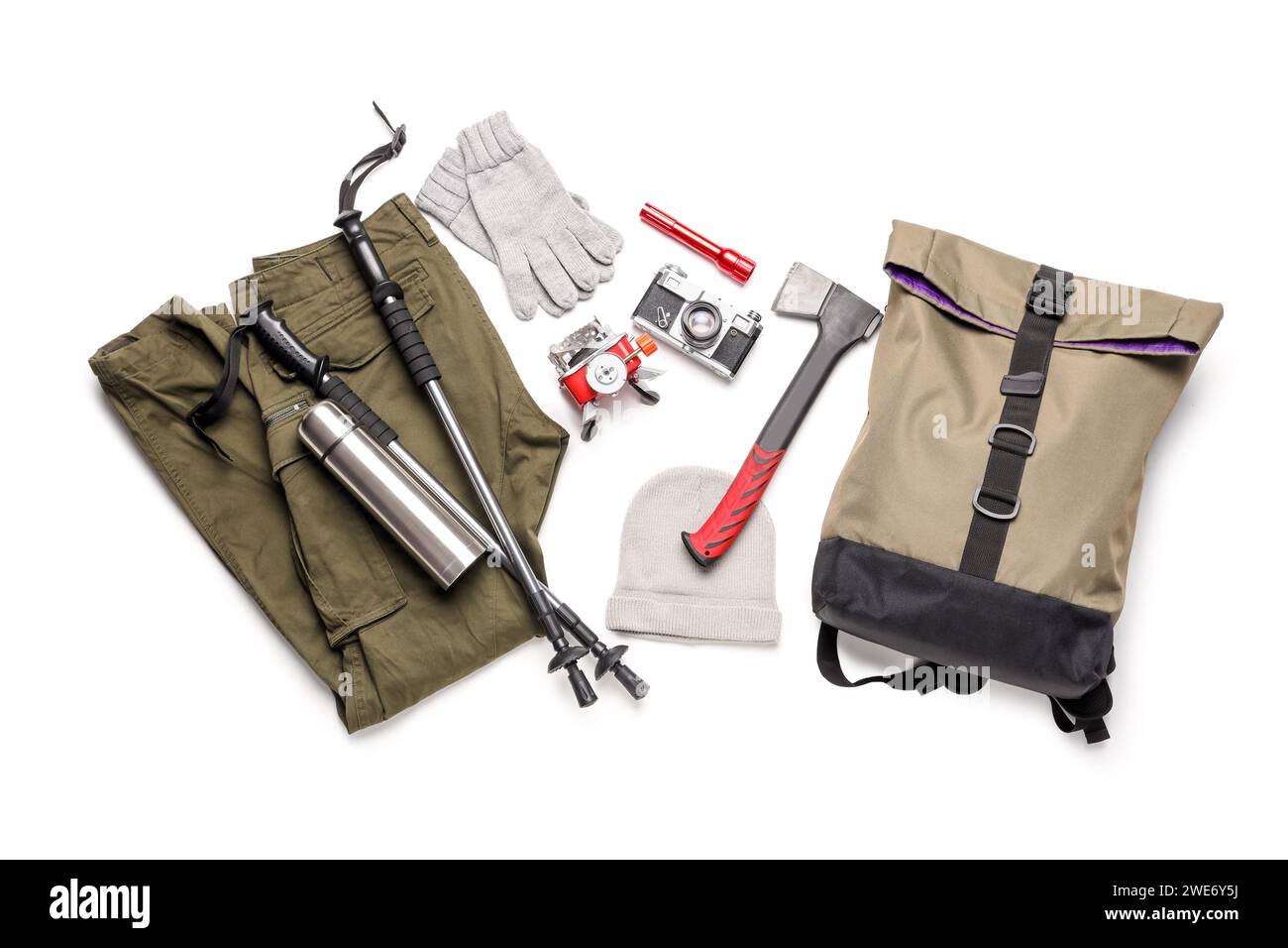 Set of hiking essentials with backpack, hatchet and outdoor gear on ...
