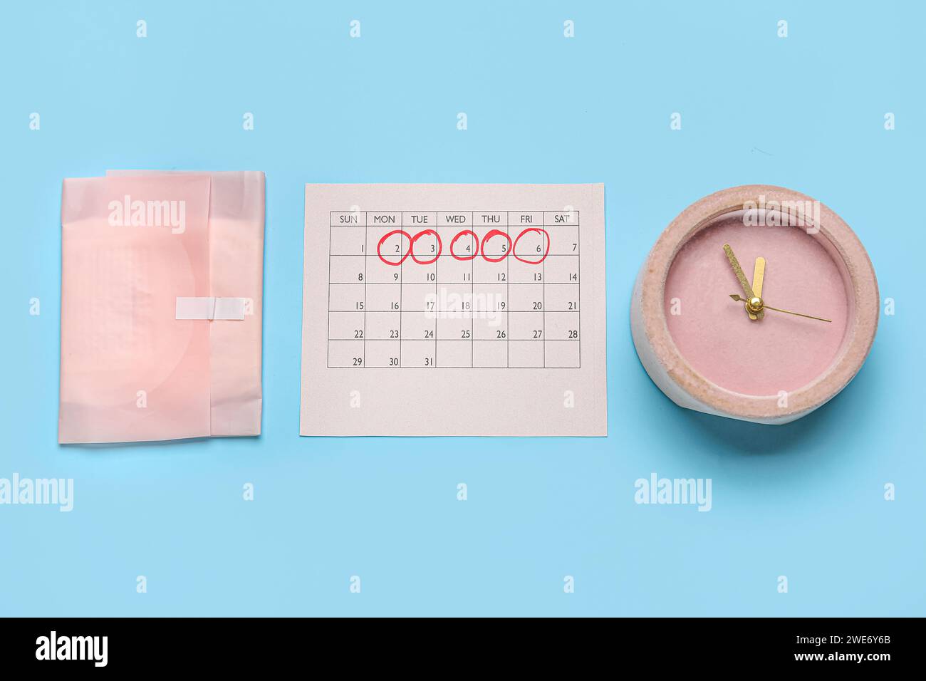Menstrual pad, calendar and alarm clock on color background Stock Photo ...