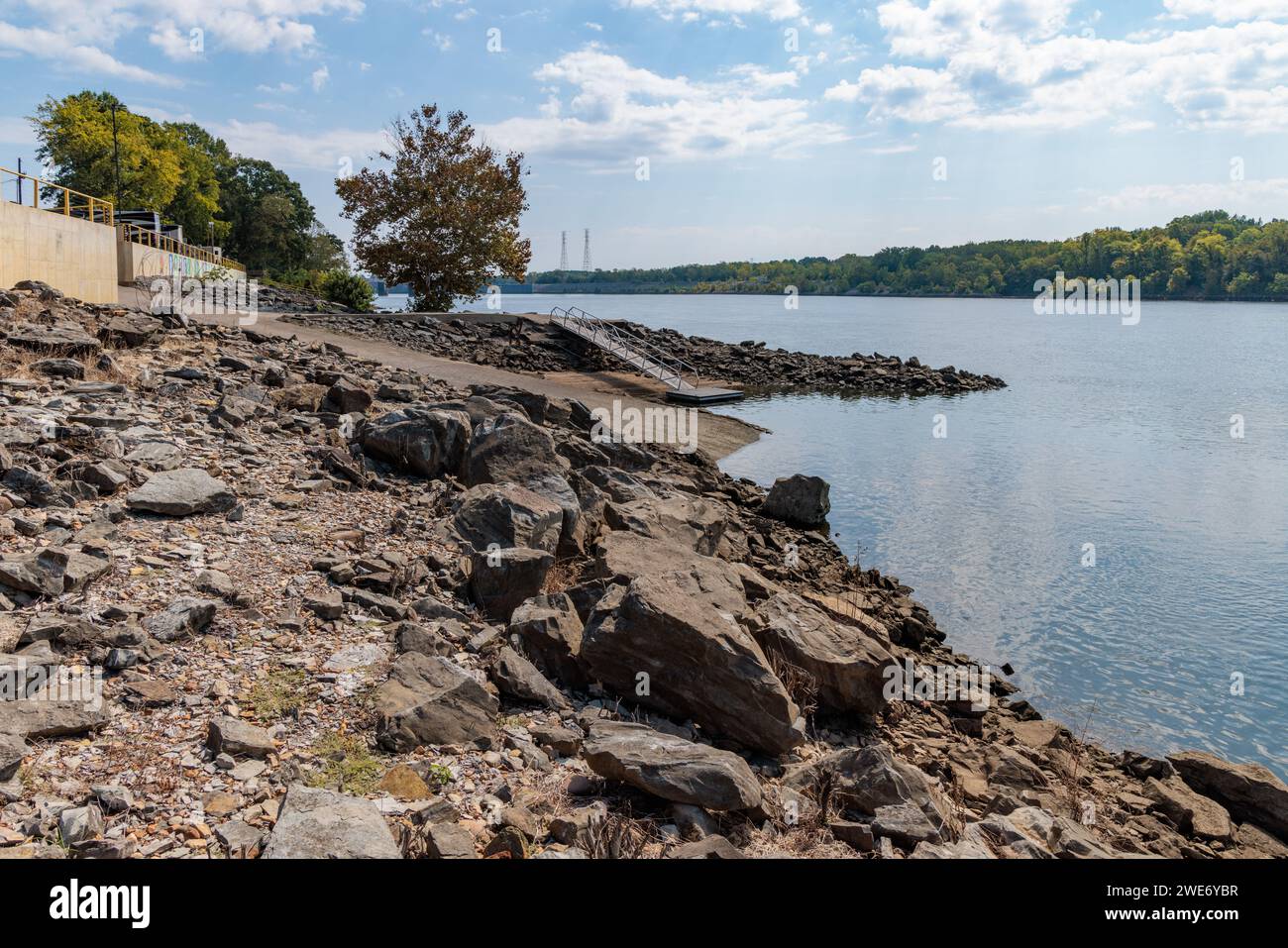Floating dock and pier next to a boat ramp along the bank of the ...