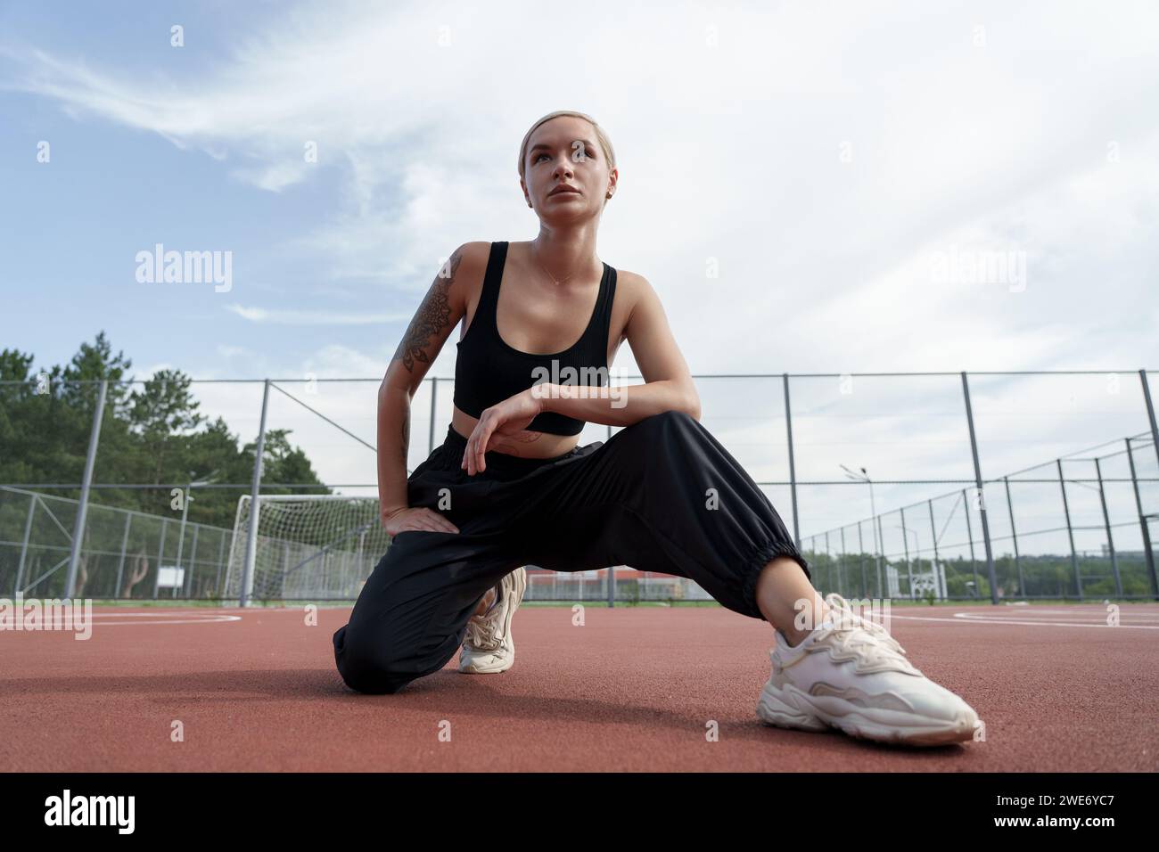 Deep Lunge Stretch: Pre-Exercise Routine Outdoors Stock Photo - Alamy