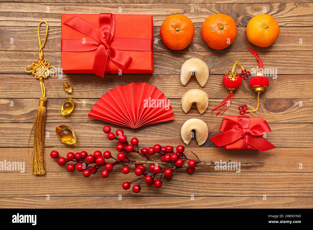 Gift boxes with fortune cookies, mandarins and Chinese symbols on ...