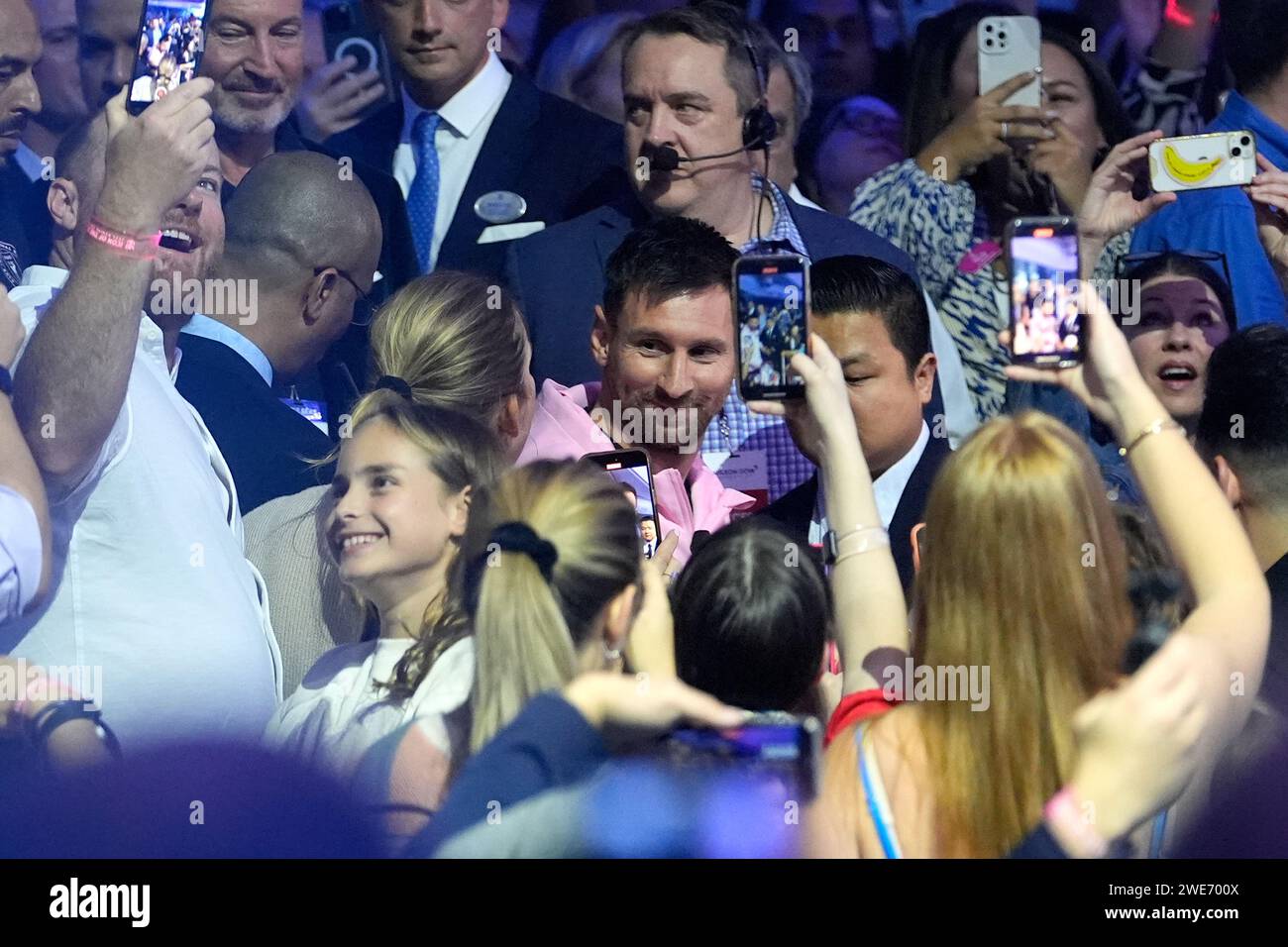 Inter Miami soccer player Lionel Messi walks through the crowd as he ...