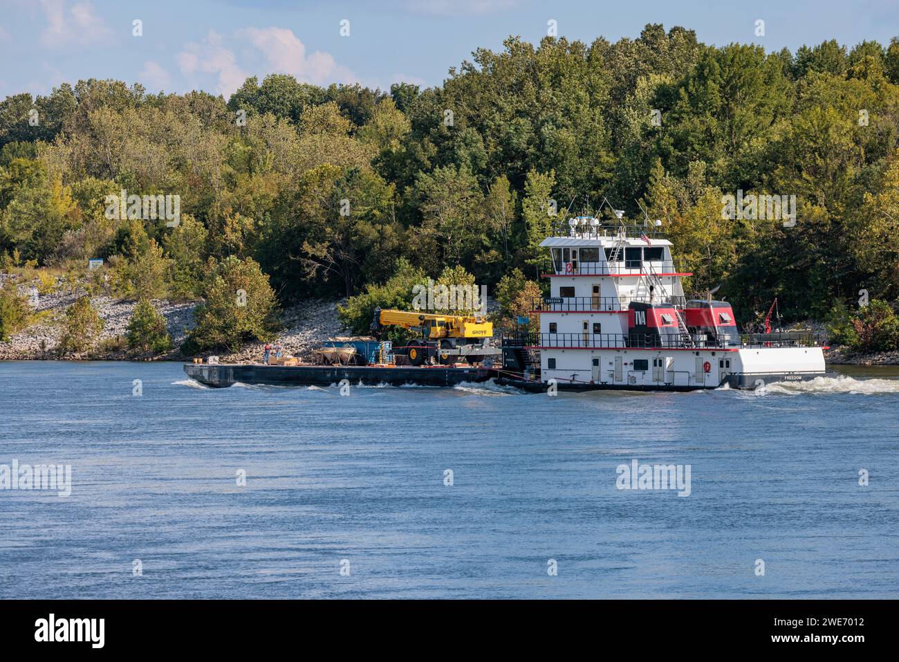 Tennessee Valley Authority tug boat Freedom pushing a barge with ...