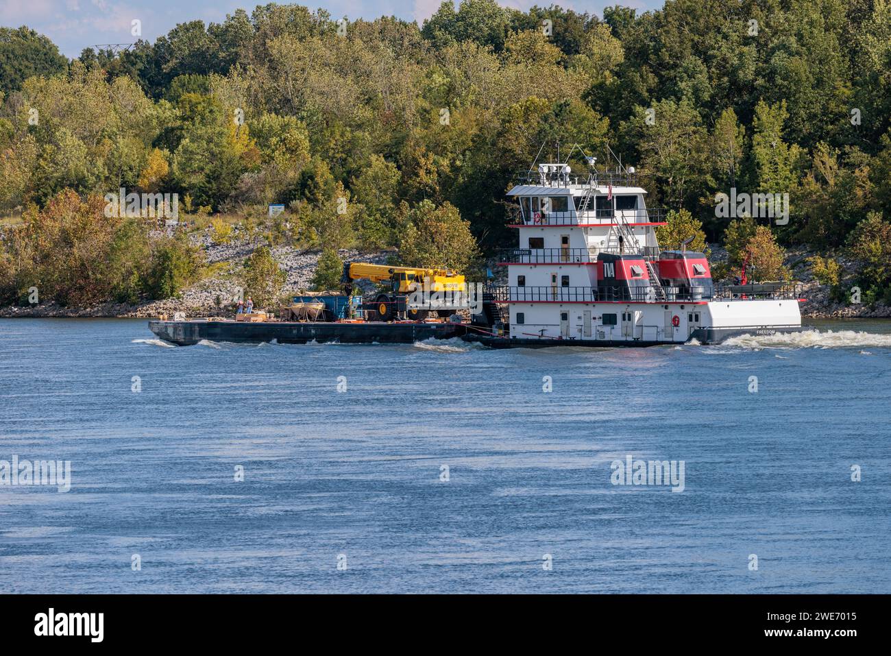 Tennessee Valley Authority tug boat Freedom pushing a barge with ...