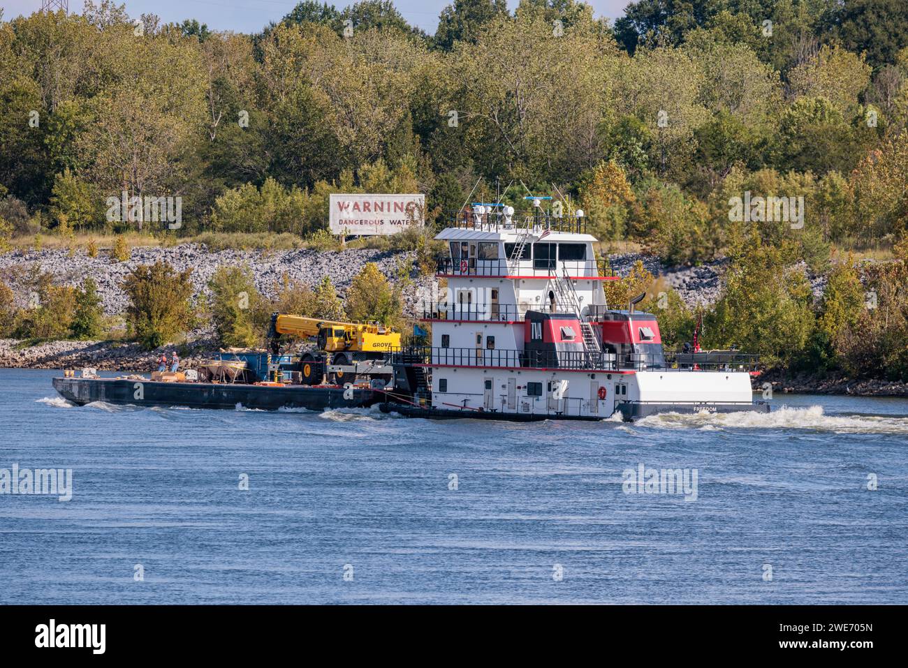 Tennessee Valley Authority tug boat Freedom pushing a barge with ...
